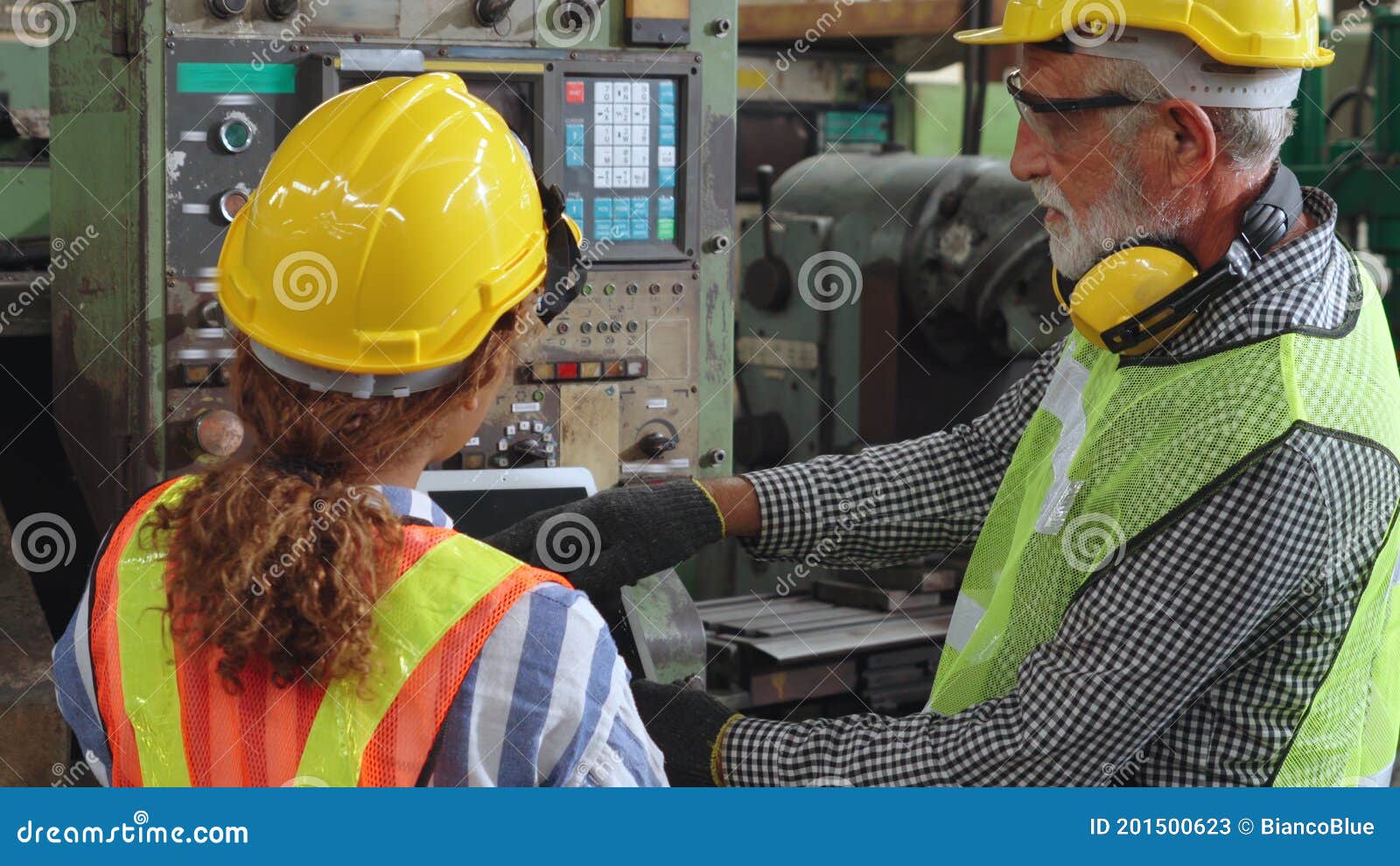 Group of Factory Workers Using Machine Equipment in Factory Workshop ...