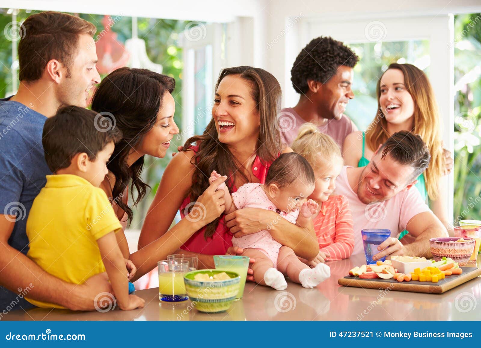 Group of Families Enjoying Snacks at Home Stock Image - Image of party ...