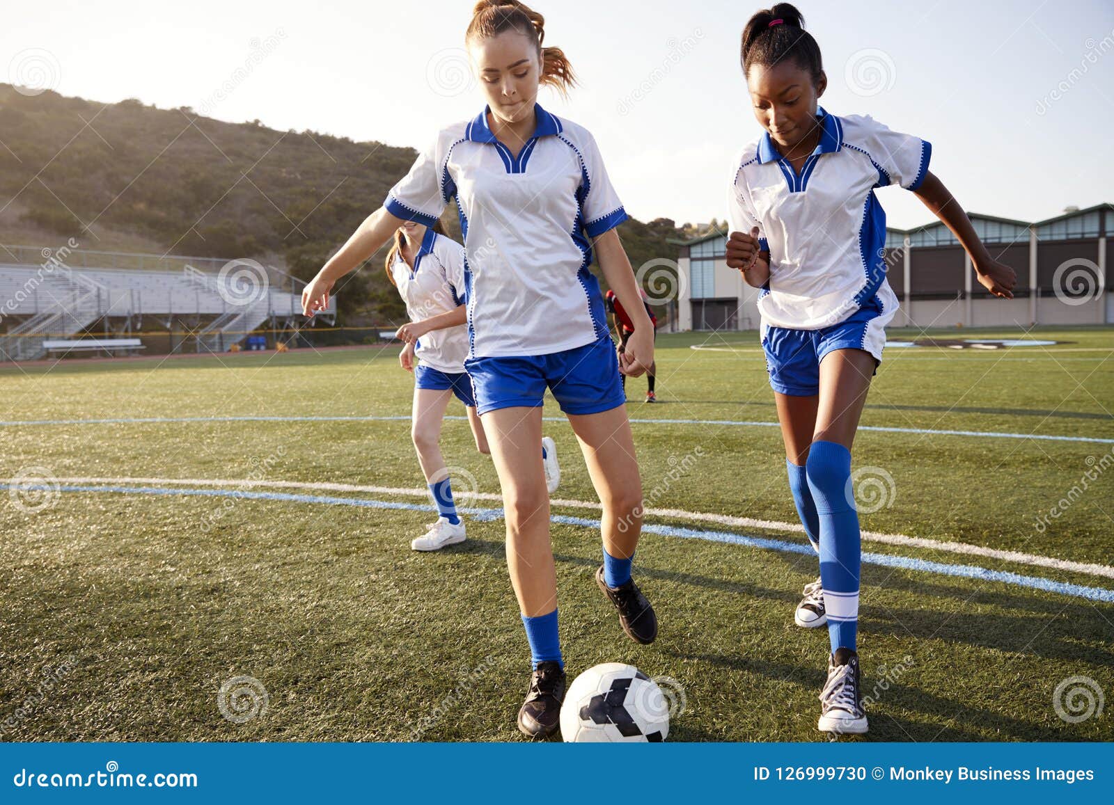 Group of Female High School Students Playing in Soccer Team Stock Photo ...