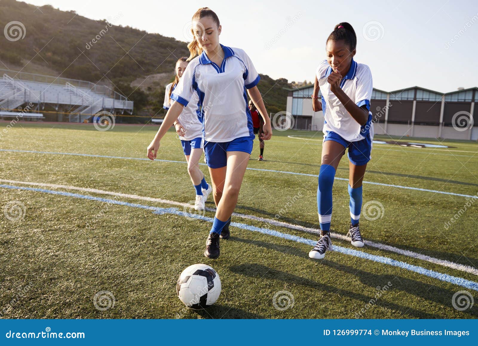 Group of Female High School Students Playing in Soccer Team Stock Photo ...
