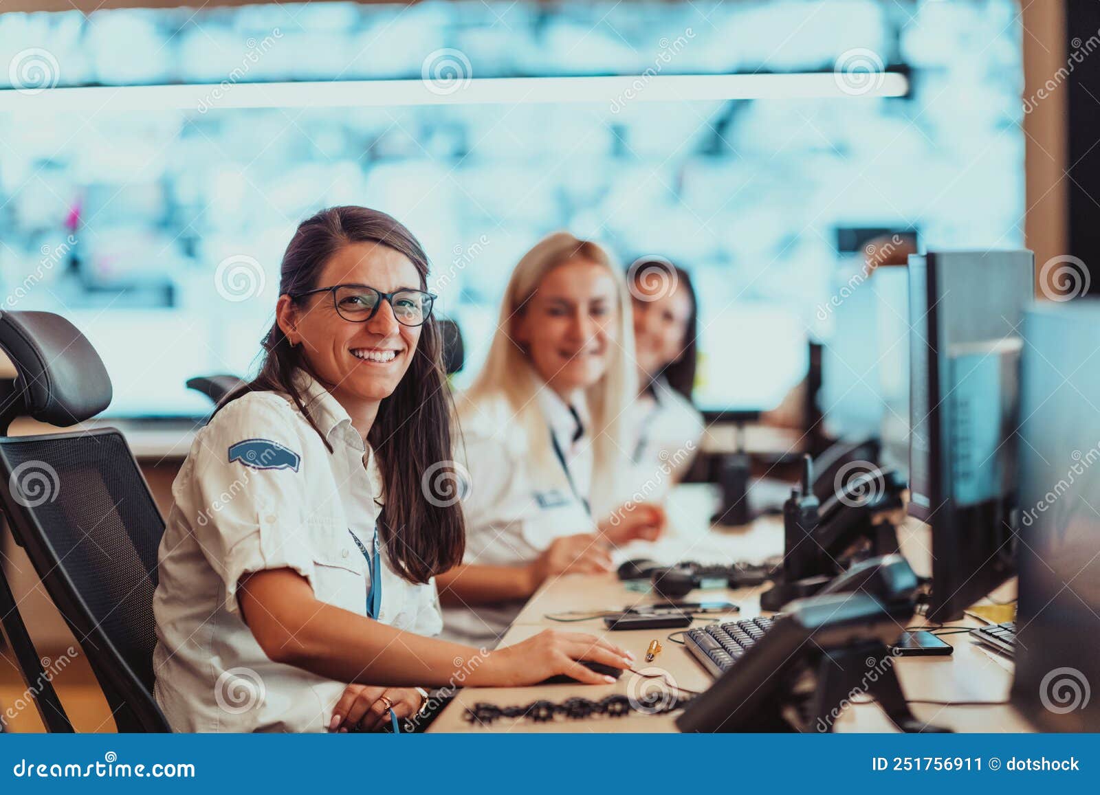 Group of Female Security Operators Working in a Data System Control ...
