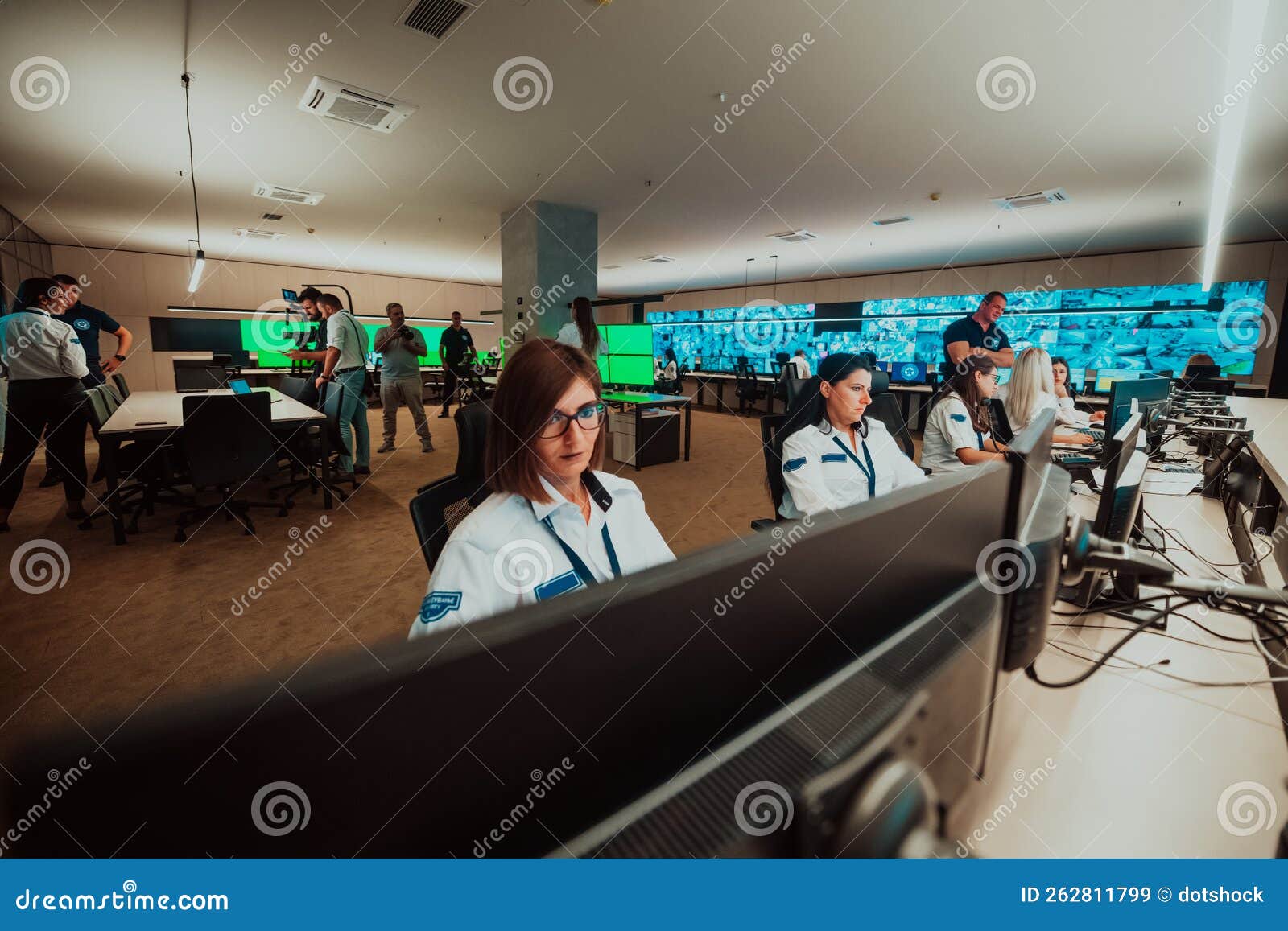 Group of Female Security Operators Working in a Data System Control ...