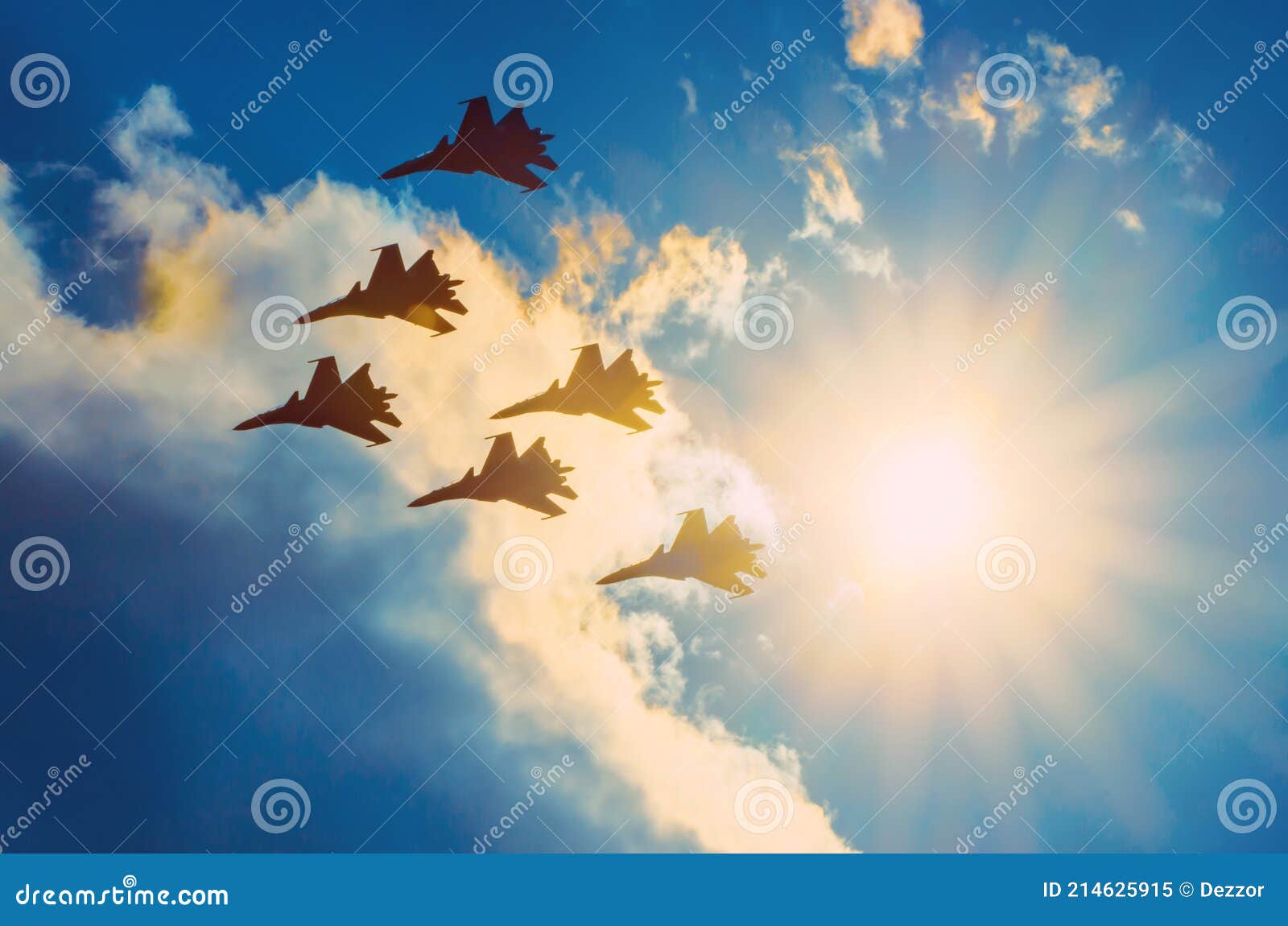 Group of Fighter Airplanes Fly with the Bright Sun in the Sky Stock ...