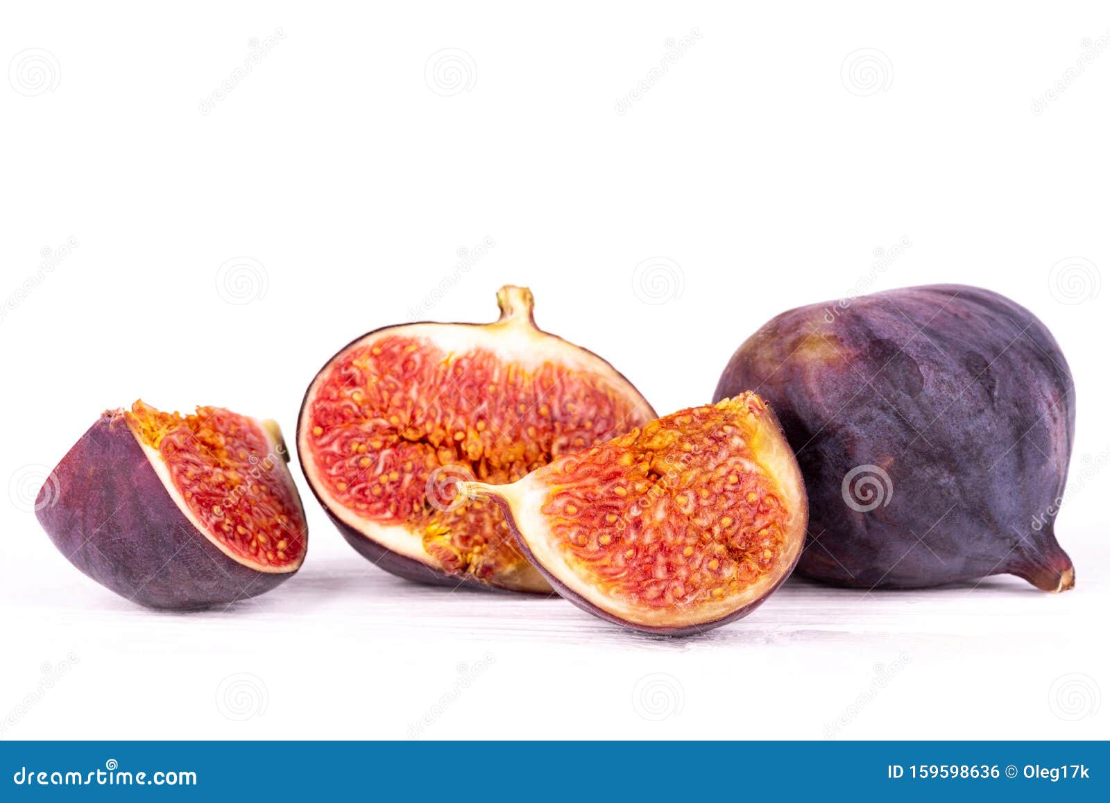 Group of Figs on White Wooden Surface Front View Stock Photo - Image of ...