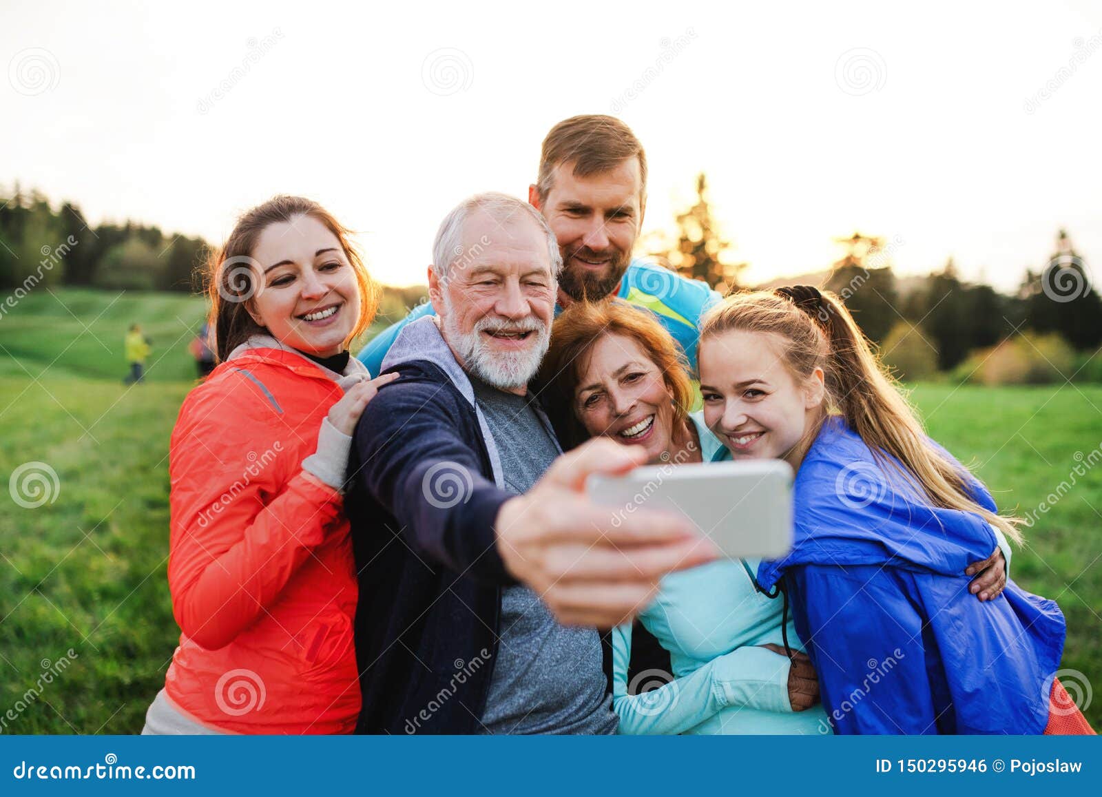 A Group of Fit and Active People Resting after Doing Exercise in Nature ...