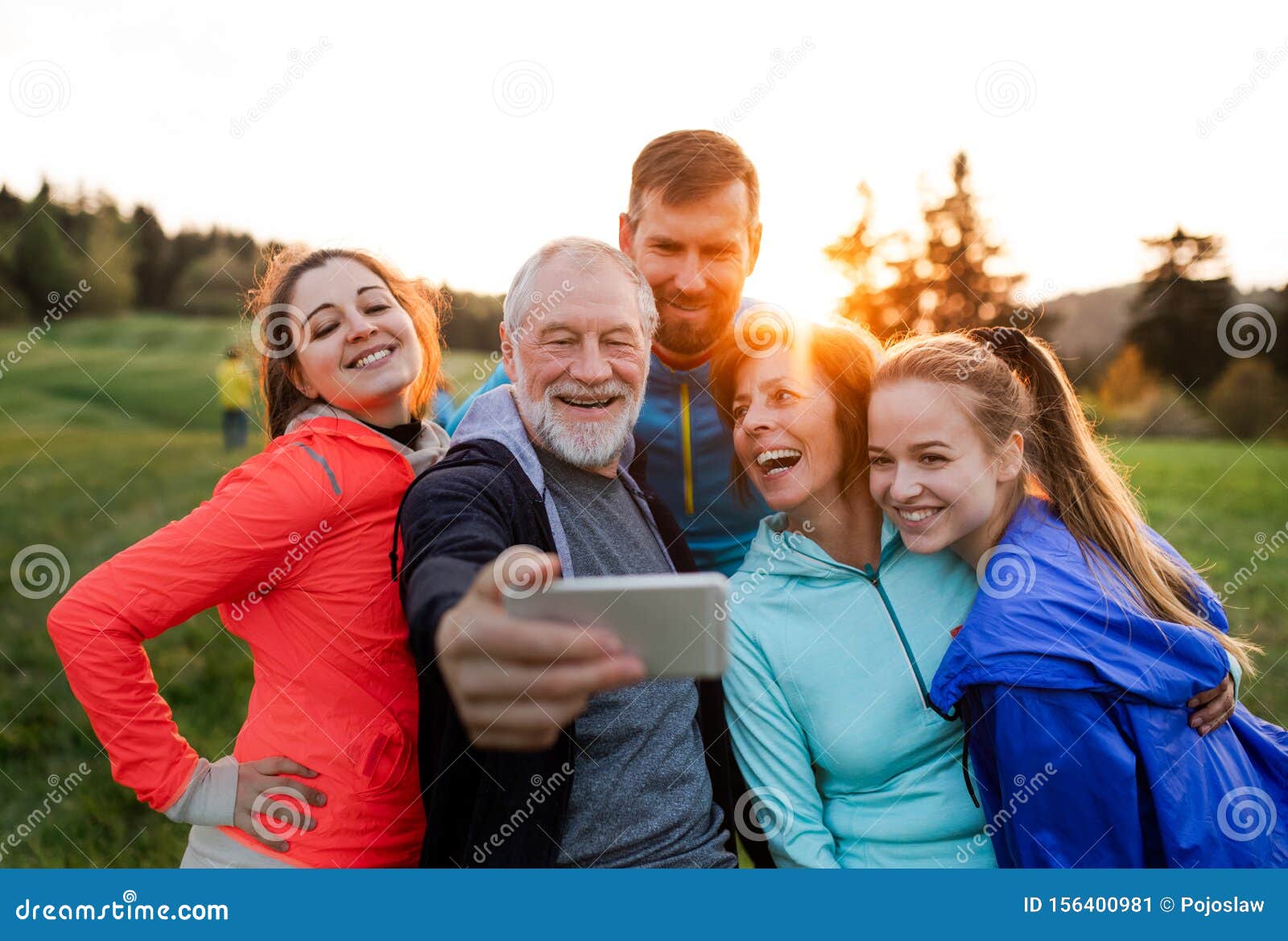 A Group of Fit and Active People Resting after Doing Exercise in Nature ...