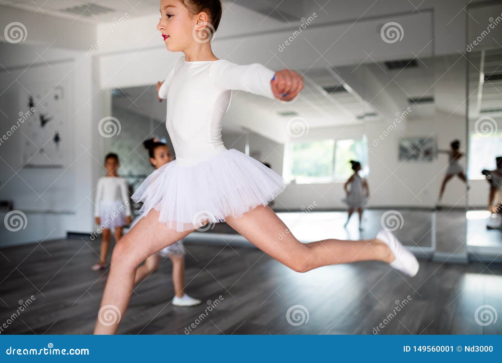 Group of Fit Happy Children Exercising Ballet in Studio Together Stock ...