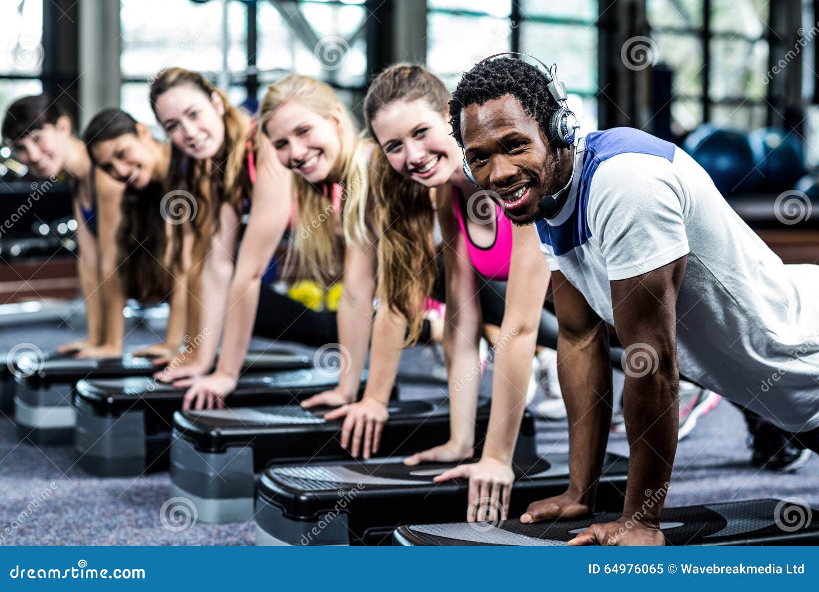 Group of Fit People Doing Some Push Ups Stock Image - Image of ...