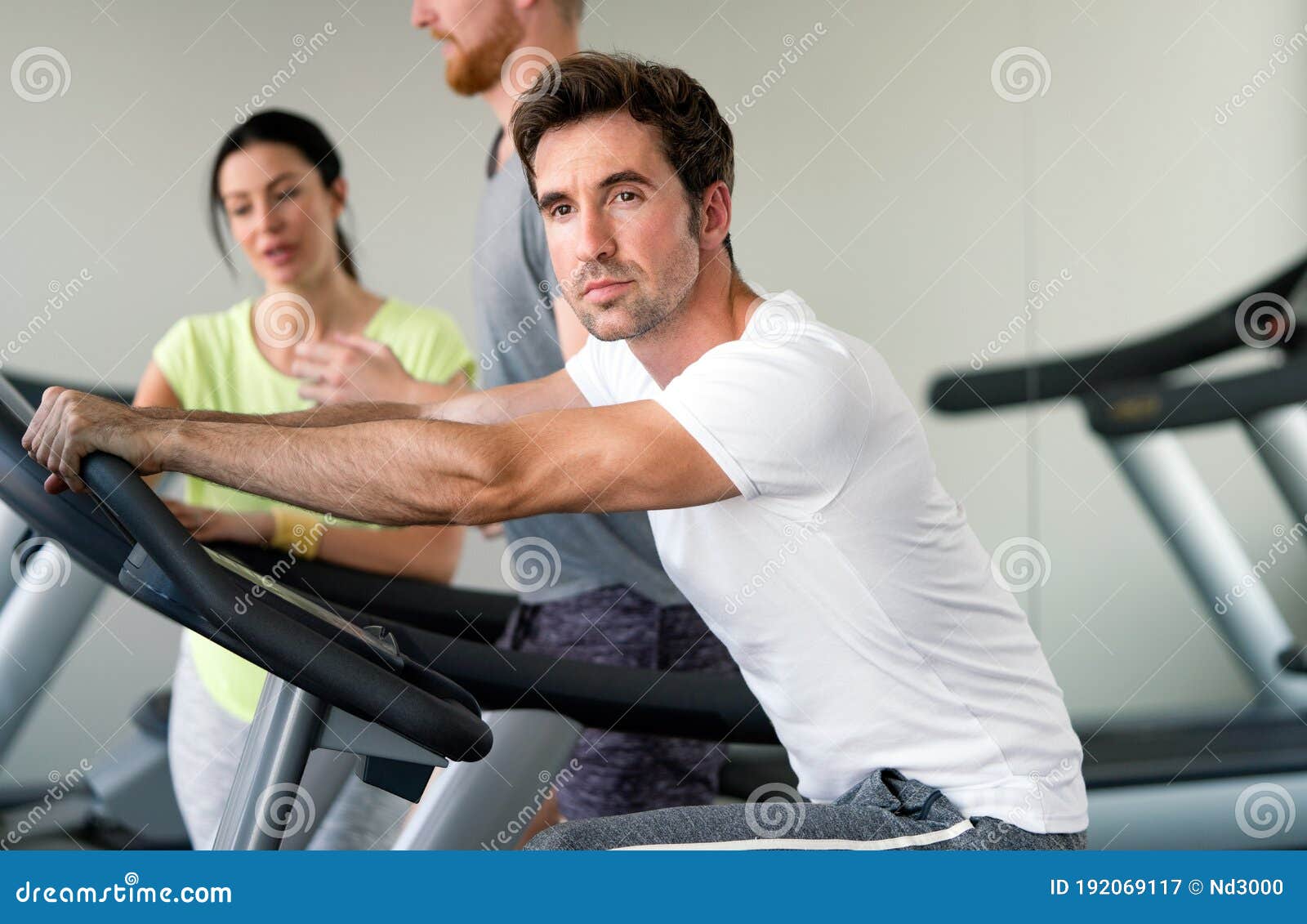 Group of People at the Gym Exercising on the Cardio Machines Stock ...