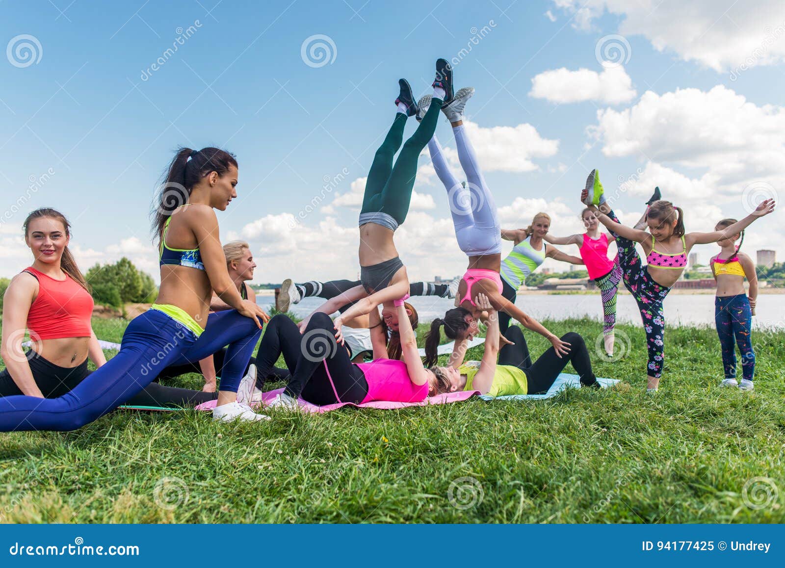 Group of Fit Women Doing Acrobatics Trick Outdoors Stock Image - Image ...