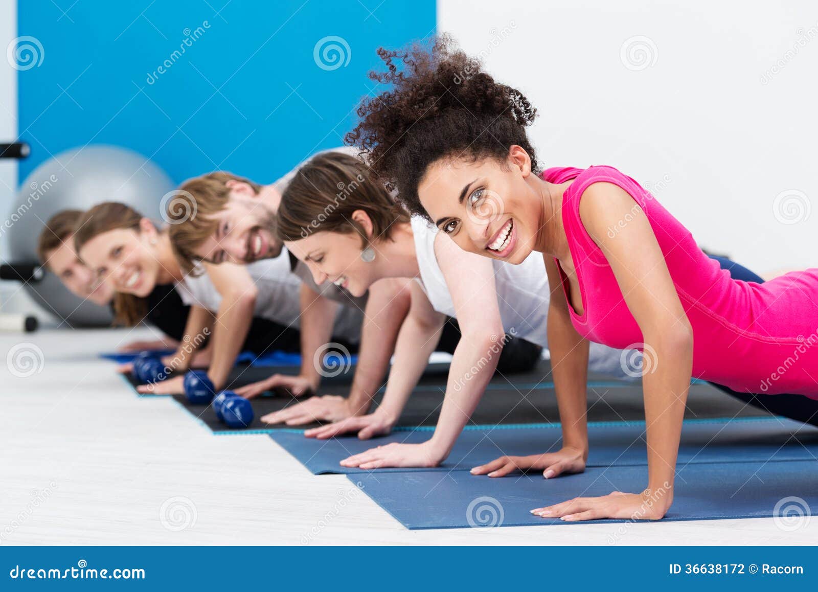 Group of Fit Young People Doing Push Ups Stock Photo - Image of body ...