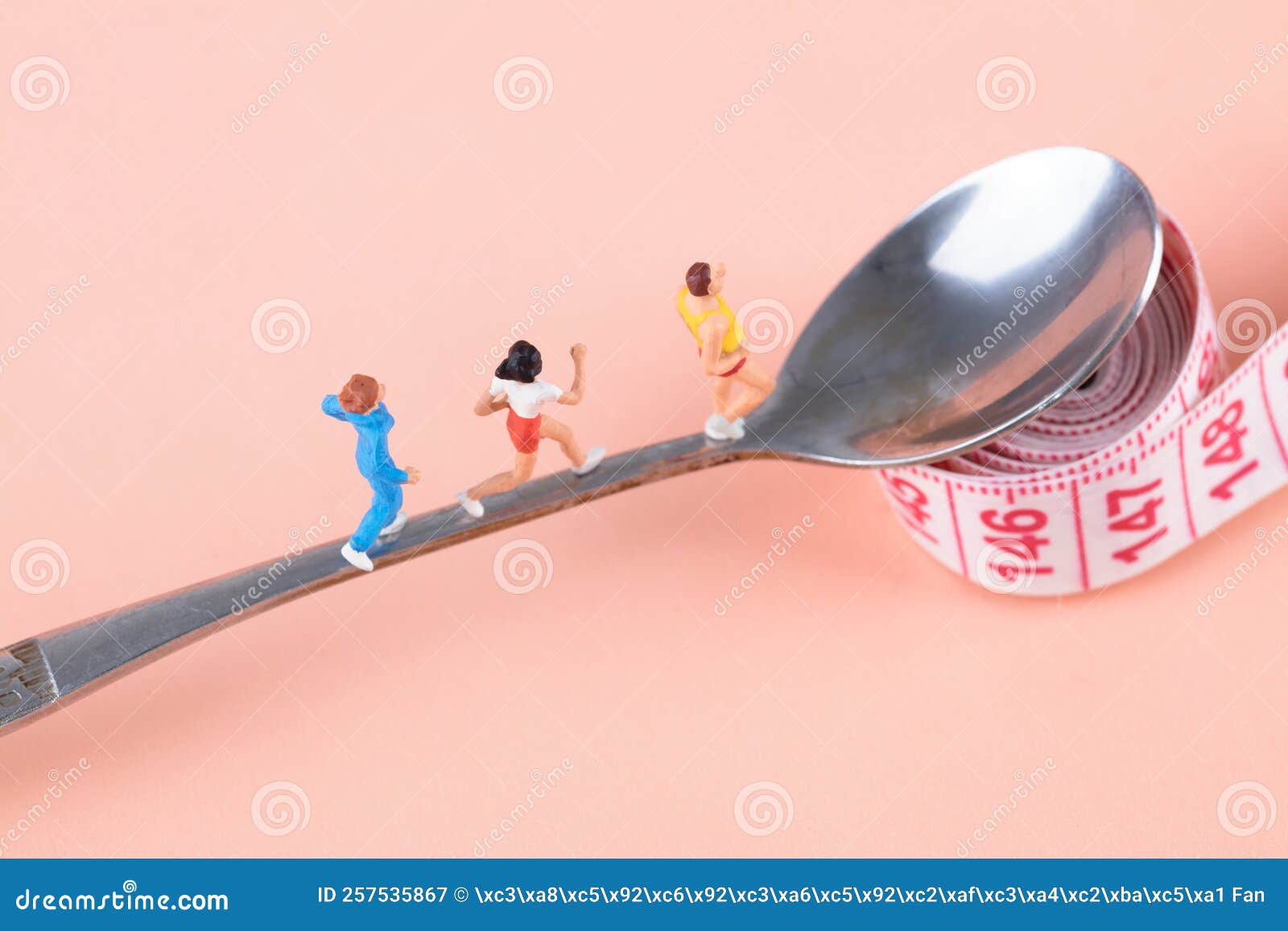 A Group of Fitness Miniature Figures Running on a Spoon Stock Image ...