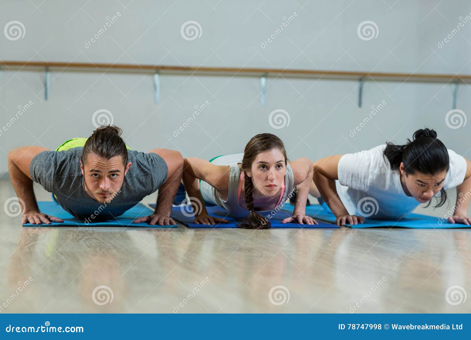 Group of Fitness Team Doing Push Ups Stock Photo - Image of balance ...