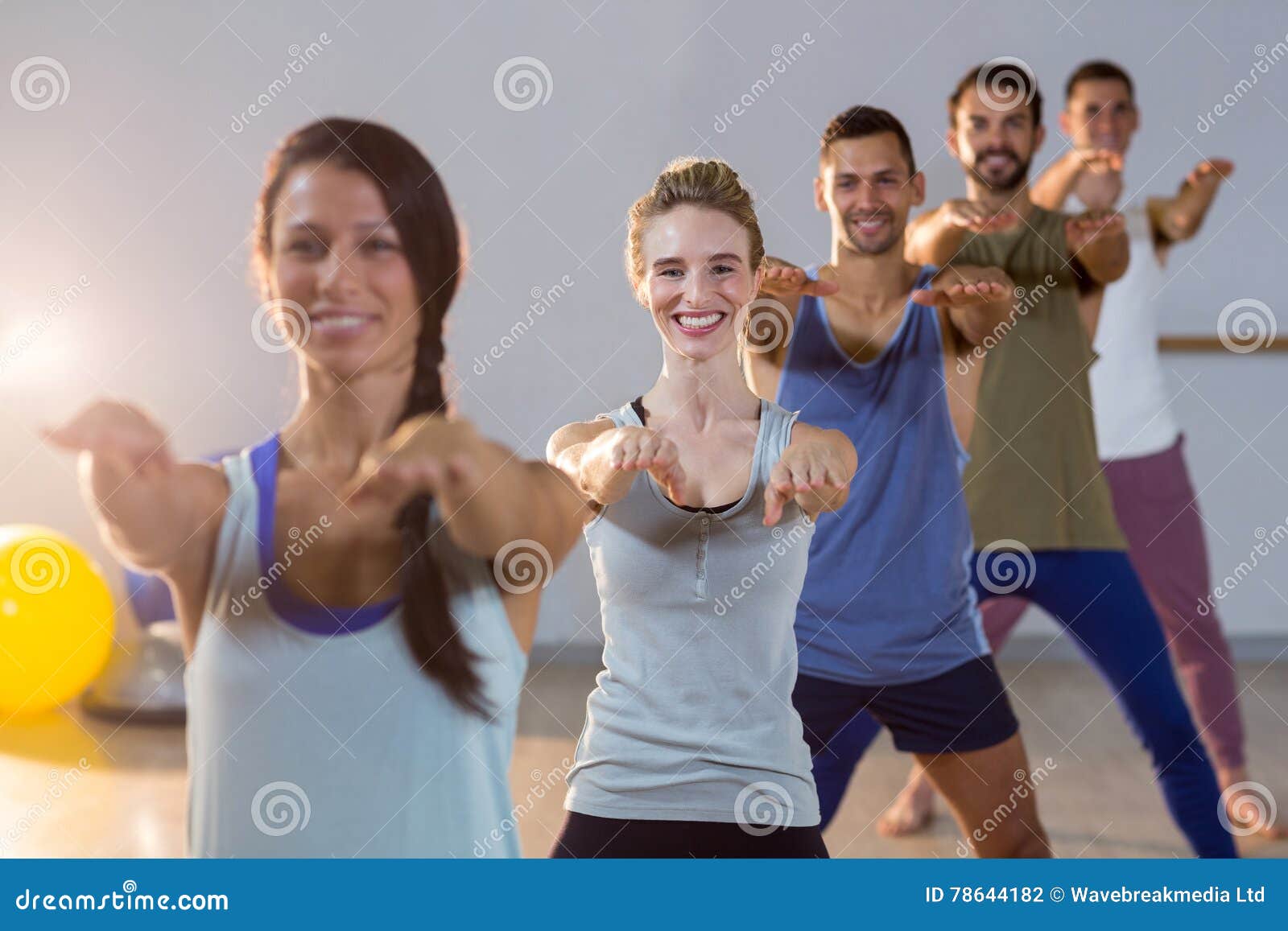 Group of Fitness Team Performing Stretching Exercise Stock Photo ...