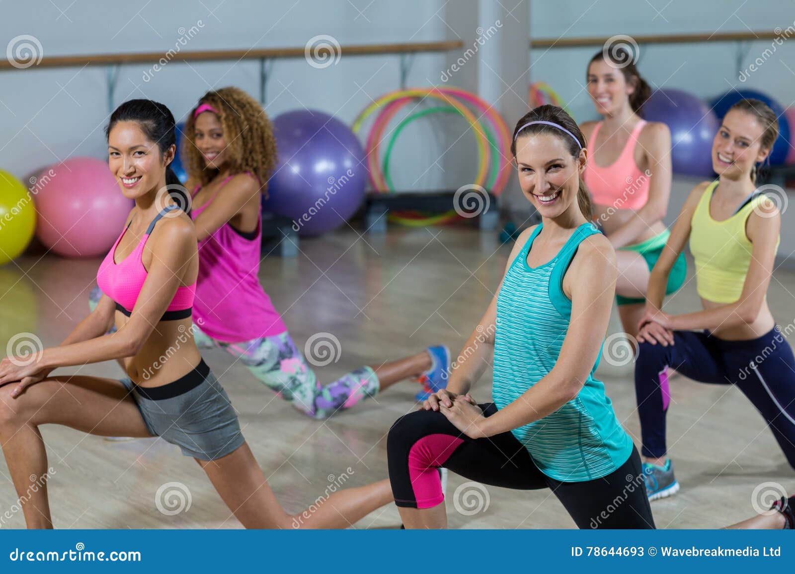 Group of Fitness Team Performing Stretching Exercise Stock Image ...