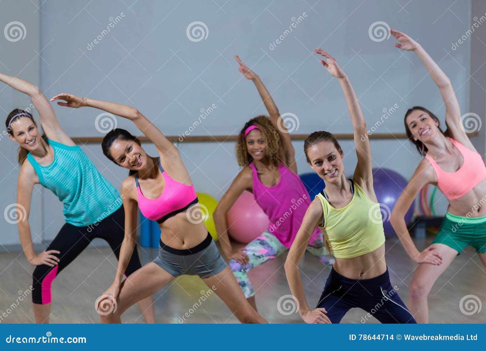 Group of Fitness Team Performing Stretching Exercise Stock Photo ...