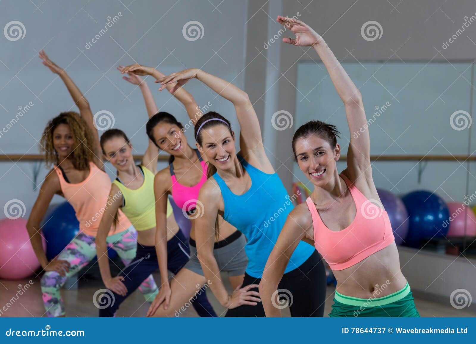 Group of Fitness Team Performing Stretching Exercise Stock Image ...