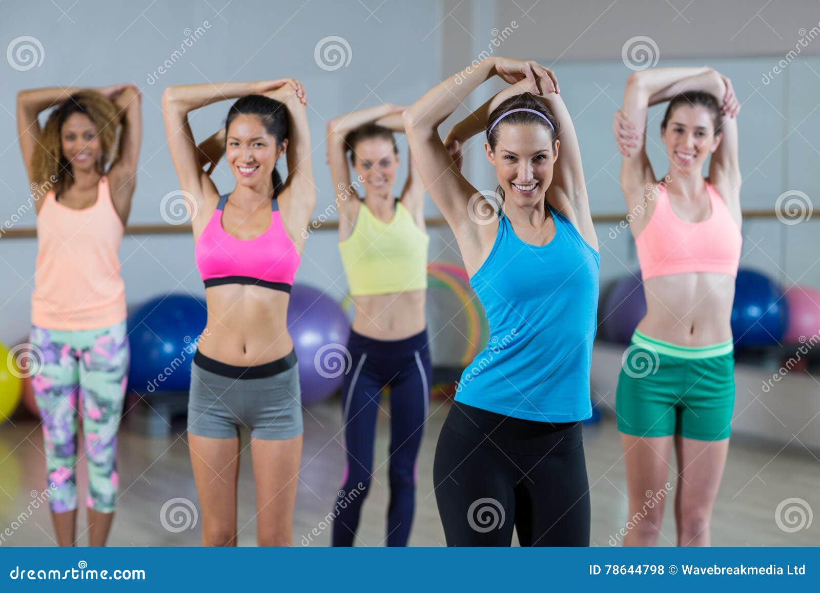 Group of Fitness Team Performing Stretching Exercise Stock Photo ...
