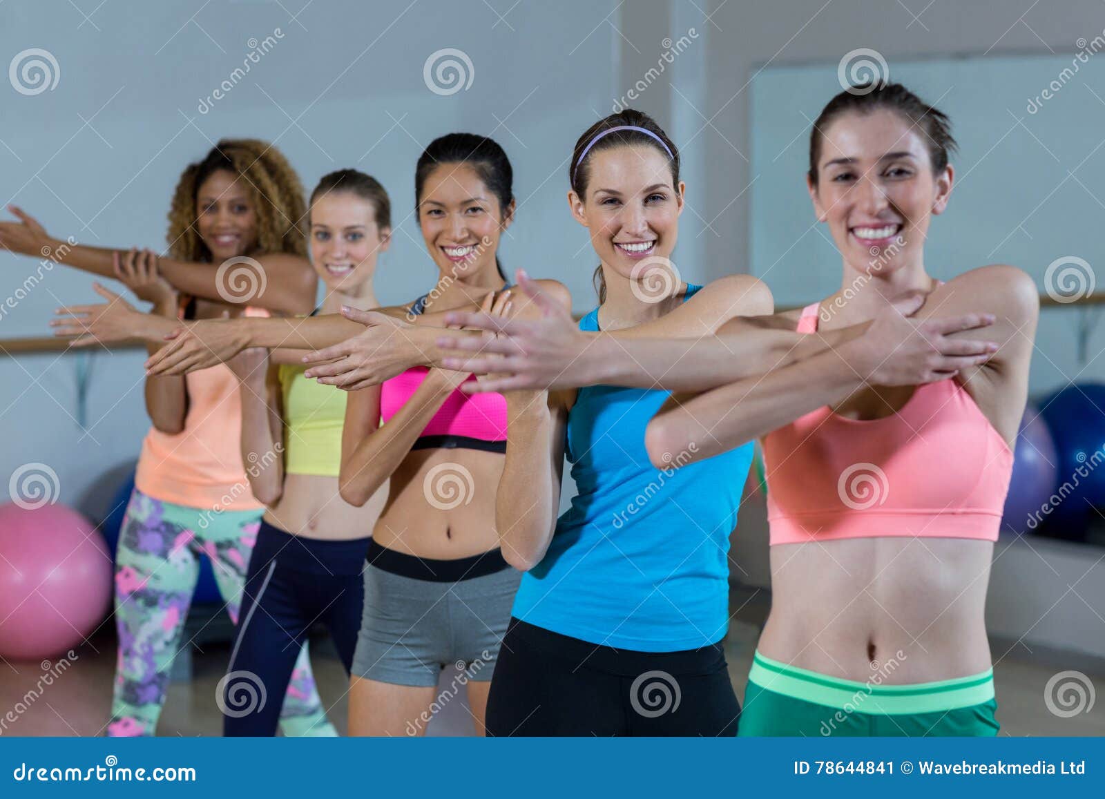 Group of Fitness Team Performing Stretching Exercise Stock Image ...