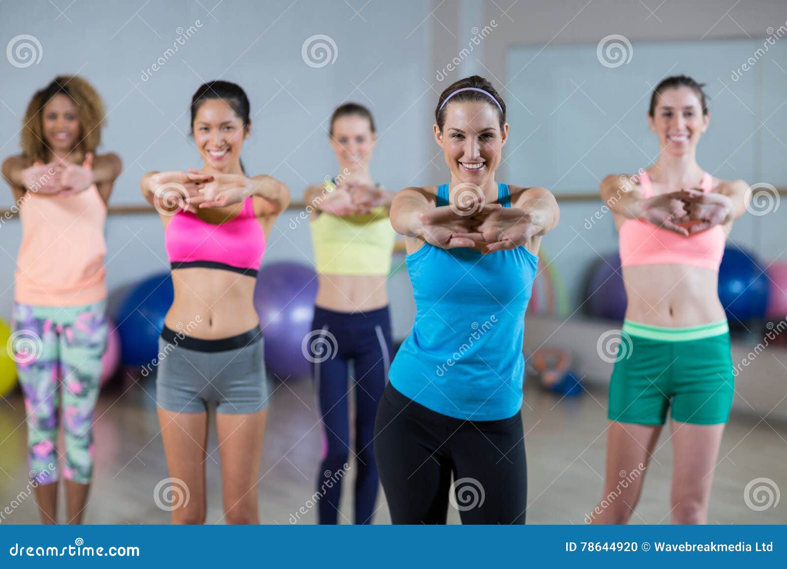 Group of Fitness Team Performing Stretching Exercise Stock Photo ...