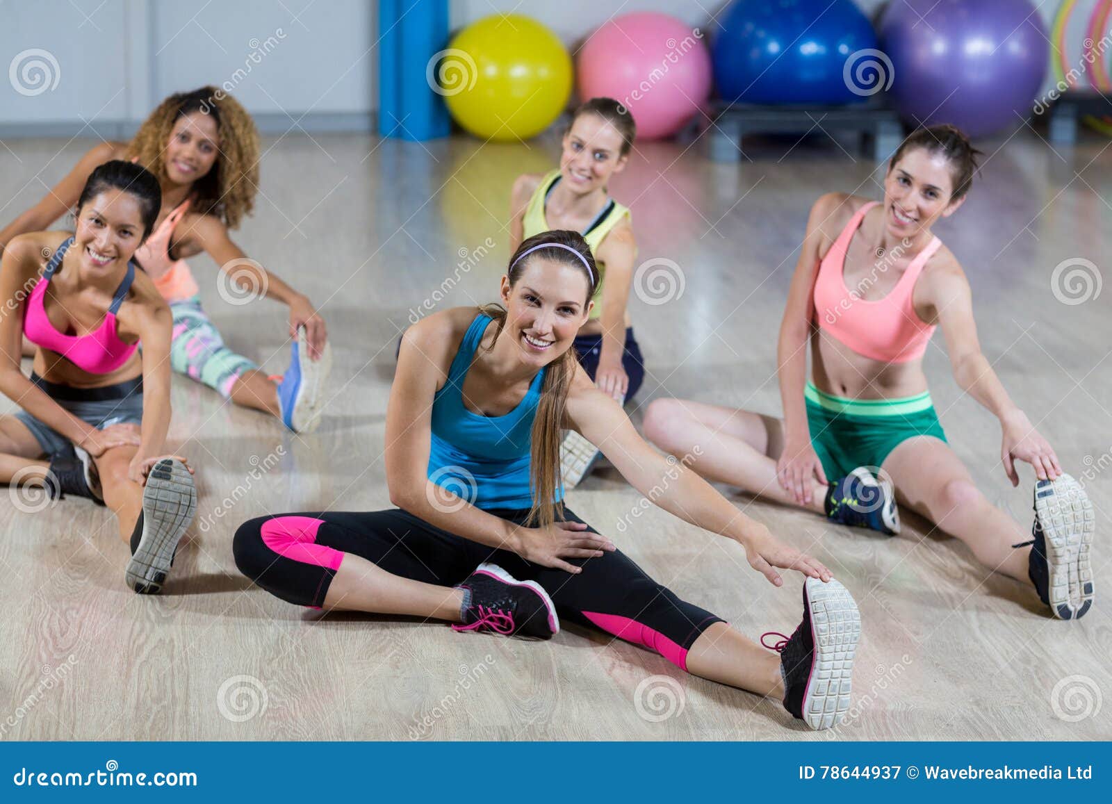 Group of Fitness Team Performing Stretching Exercise Stock Image ...