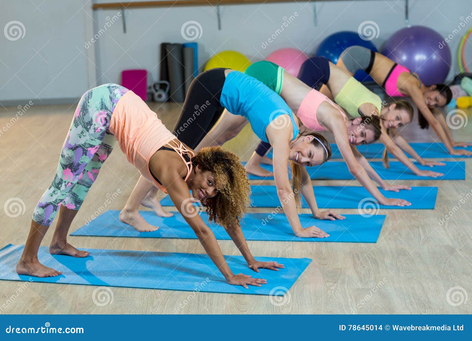 Group of Fitness Team Performing Stretching Exercise Stock Photo ...