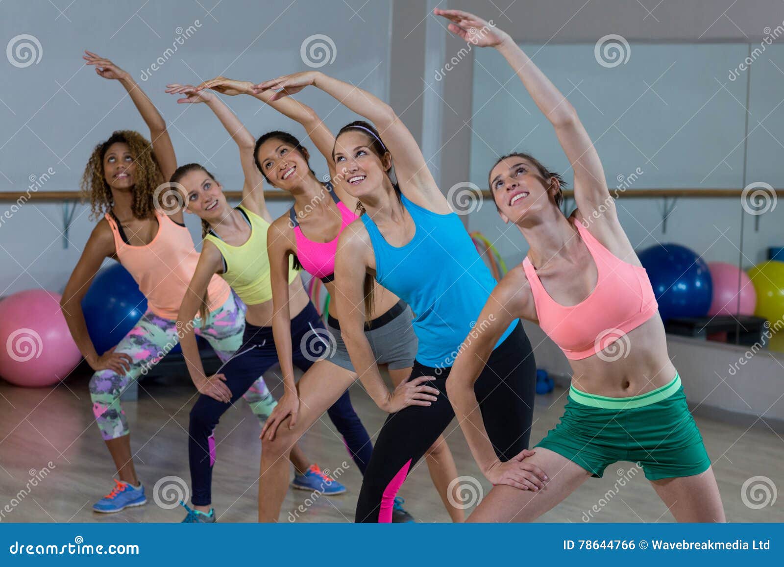 Group of Fitness Team Performing Stretching Exercise Stock Photo ...