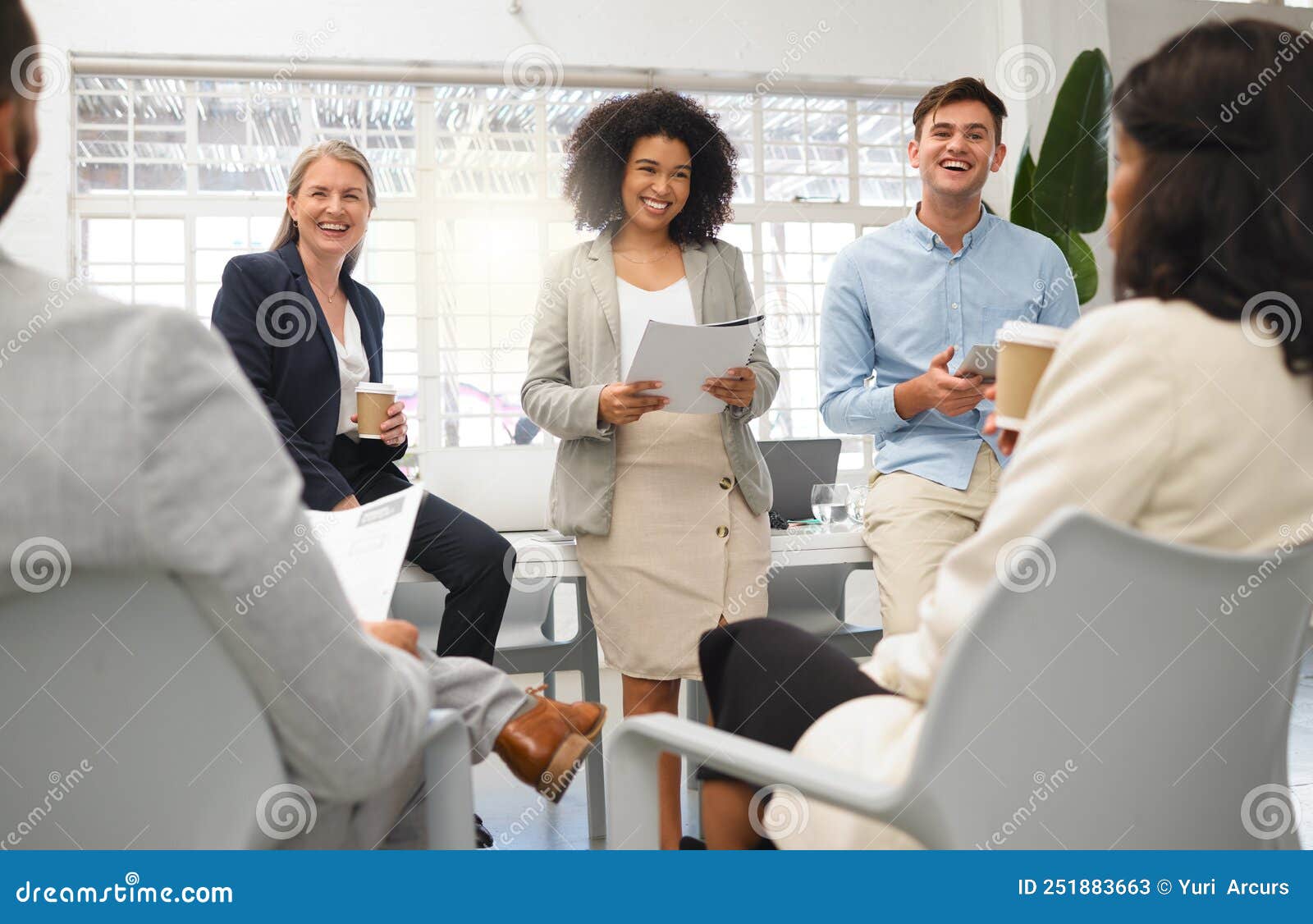 Group Of Five Diverse Businesspeople Having A Meeting In An Office At