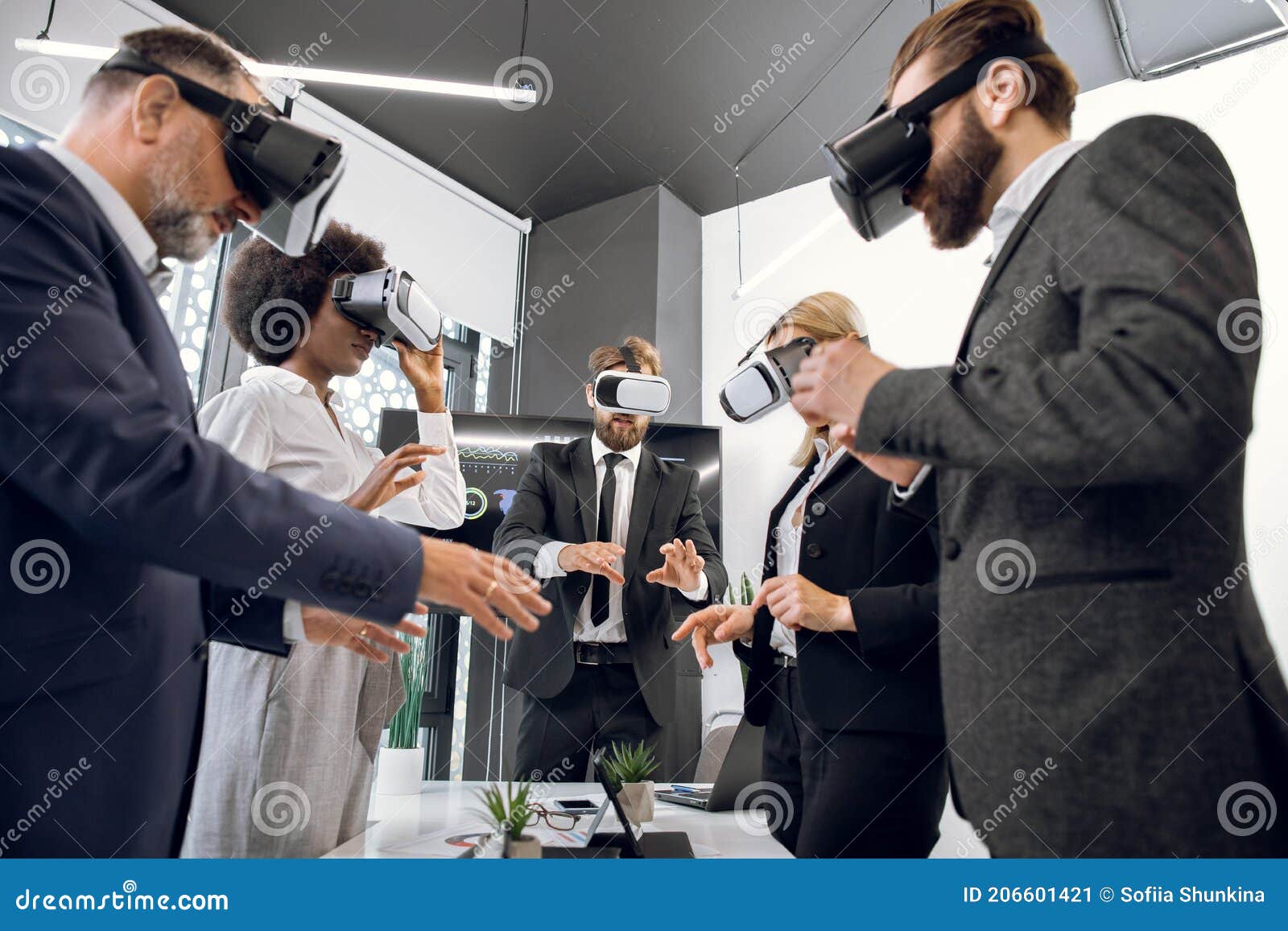 Group of Five Multiethnic People Working with Virtual Reality Glasses ...