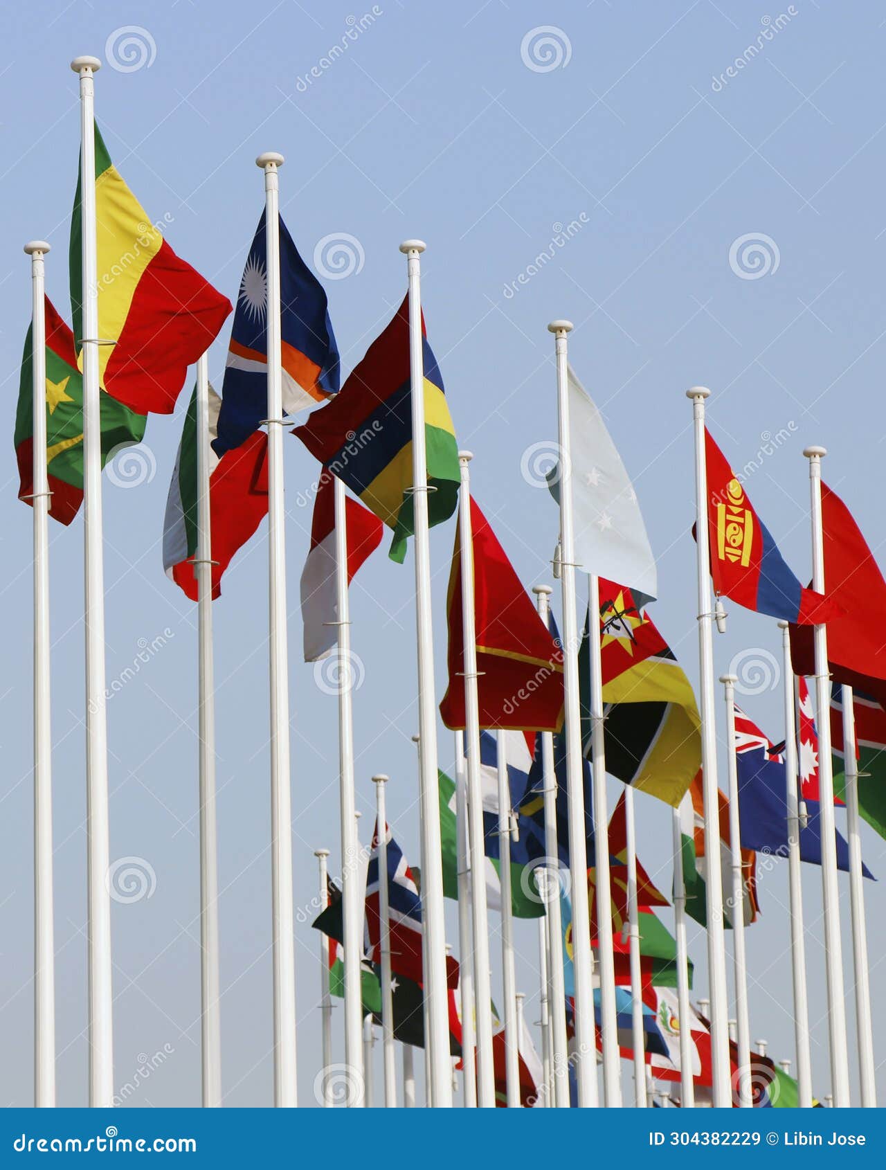 Group of Flags of Many Different Nations Against Blue Sky Stock Image ...