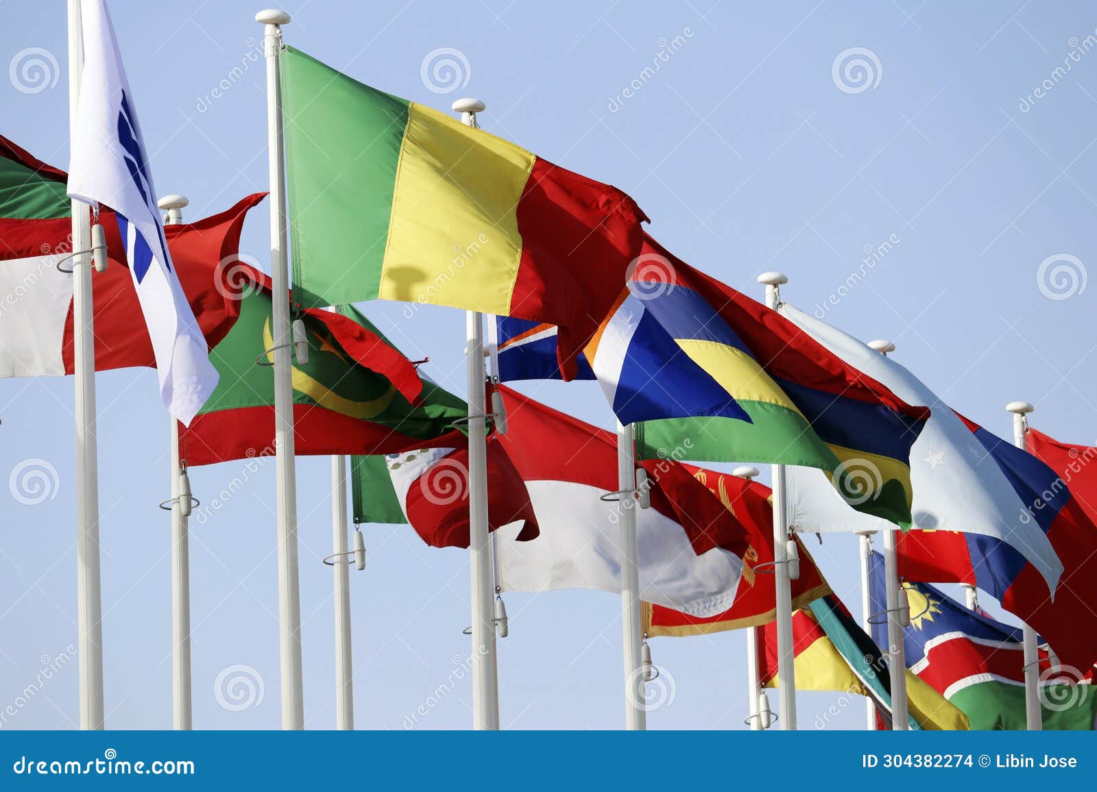 Group of Flags of Many Different Nations Against Blue Sky Stock Photo ...