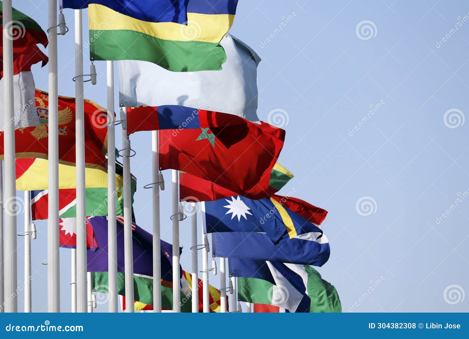 Group of Flags of Many Different Nations Against Blue Sky during Expo ...