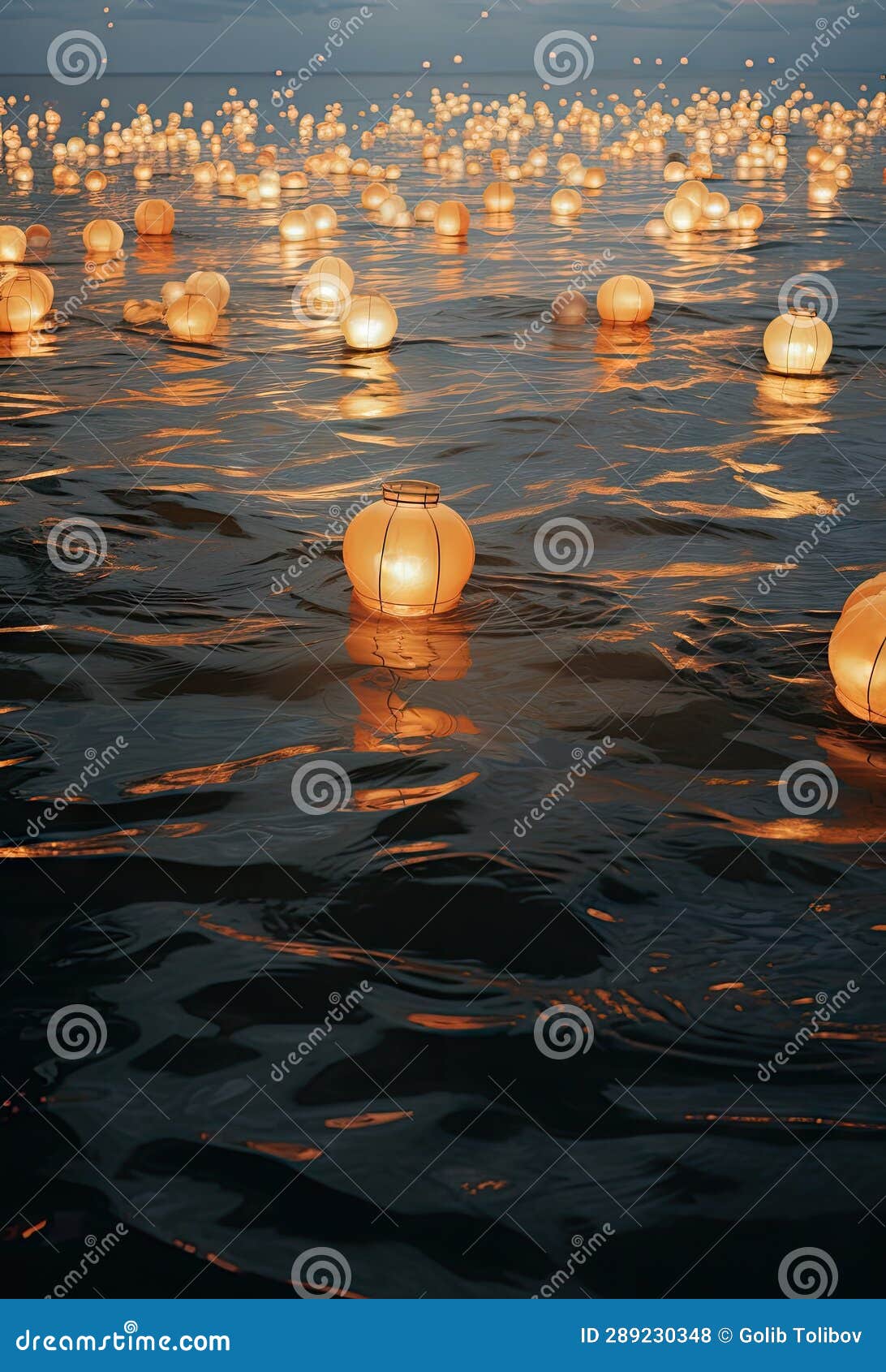 A Group of Floating Lanterns Floating in the Water Stock Photo - Image ...