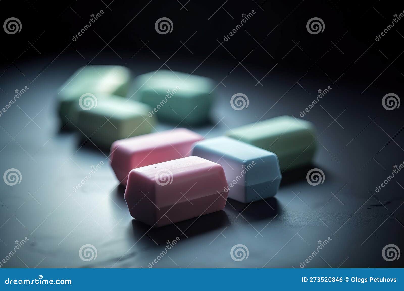 A Group of Four Different Colored Marshmallows on a Black Surface Stock ...