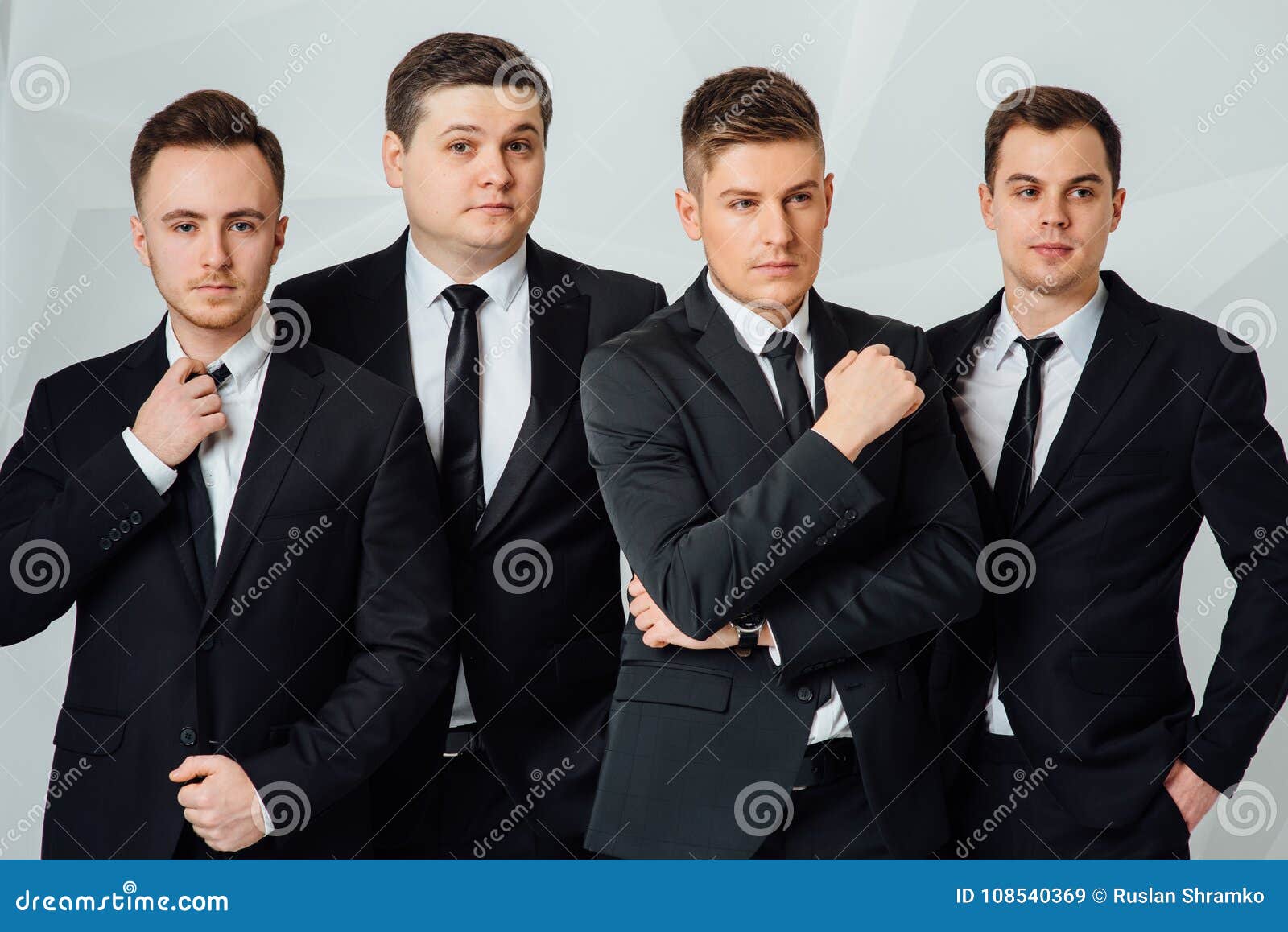 Group of Four Men in Suits White Background Stock Image - Image of ...