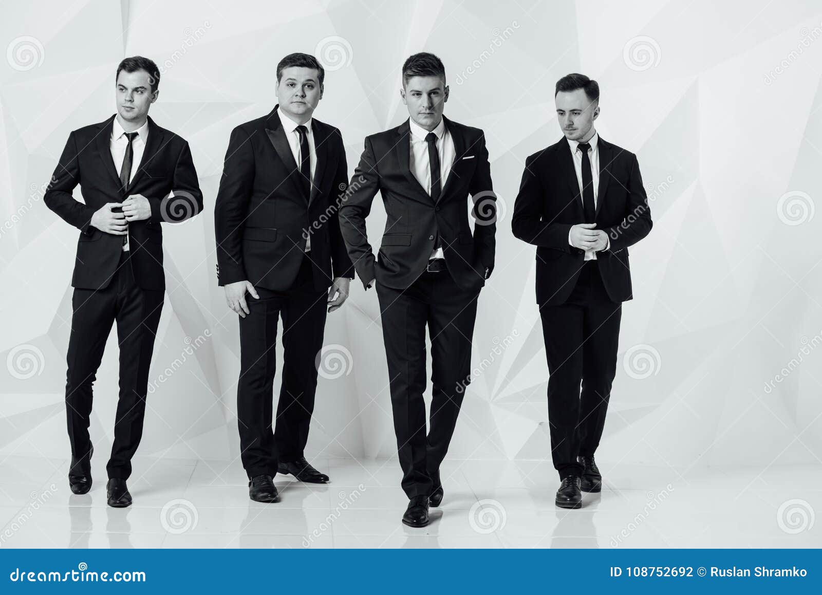 Group of Four Men in Suits White Background Stock Photo - Image of ...