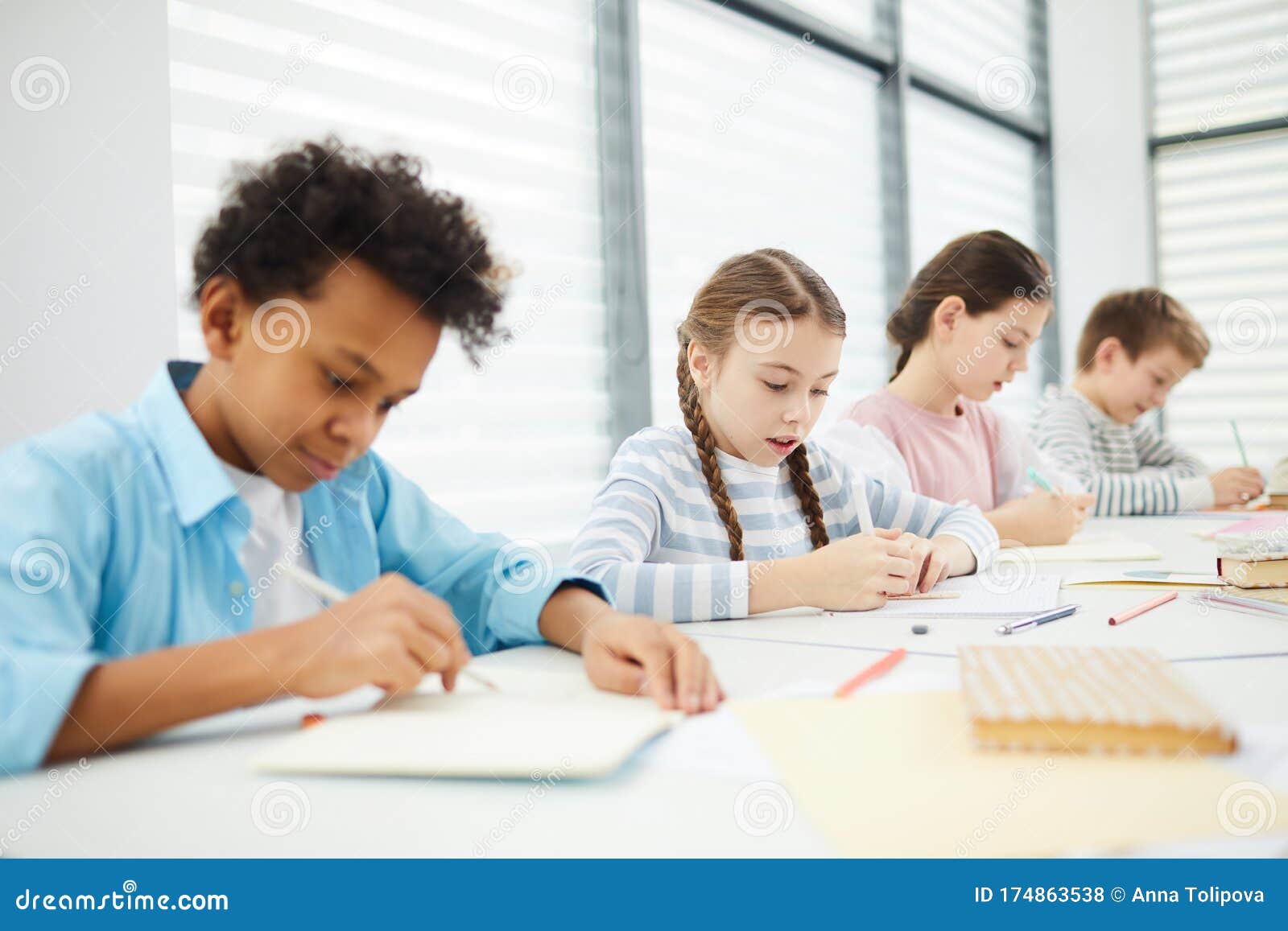 Middle Schoolers Completing Task Stock Photo - Image of schoolgirl ...