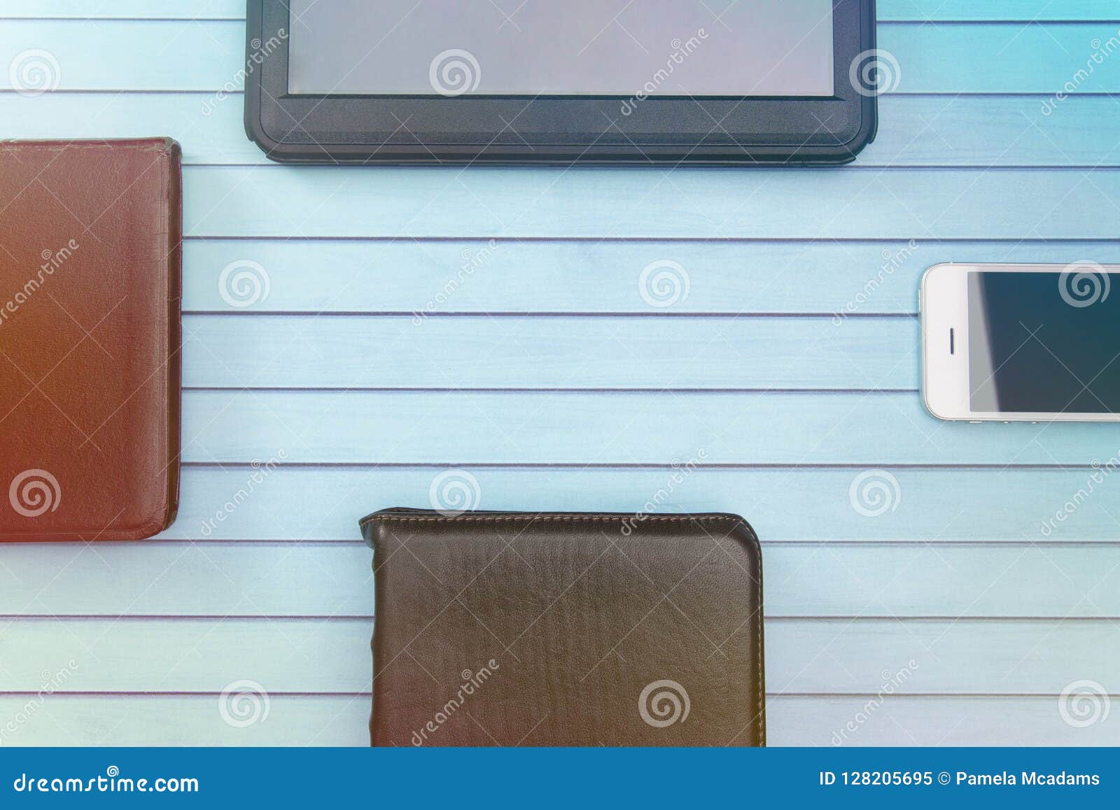 Group of Four Studing the Bible Using Tablets Phone and Paper Bi Stock ...