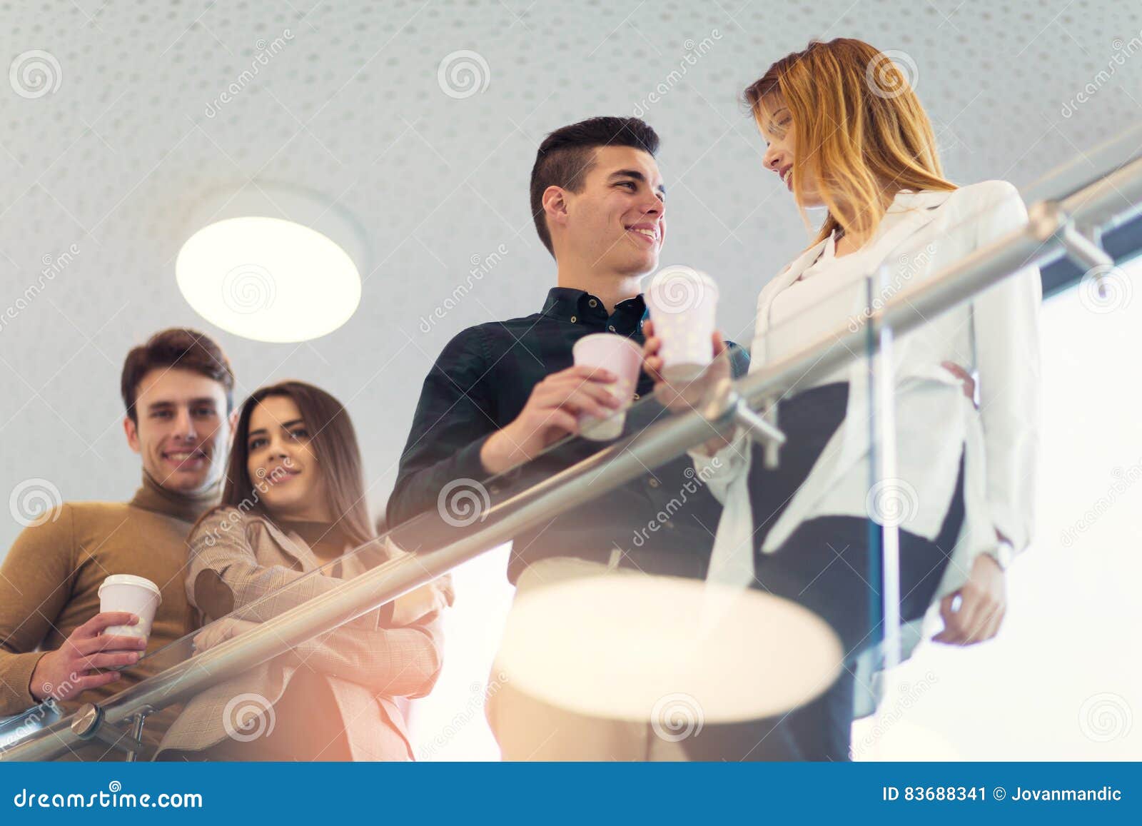 Group of Four Young Business People on a Coffee Break Stock Image ...