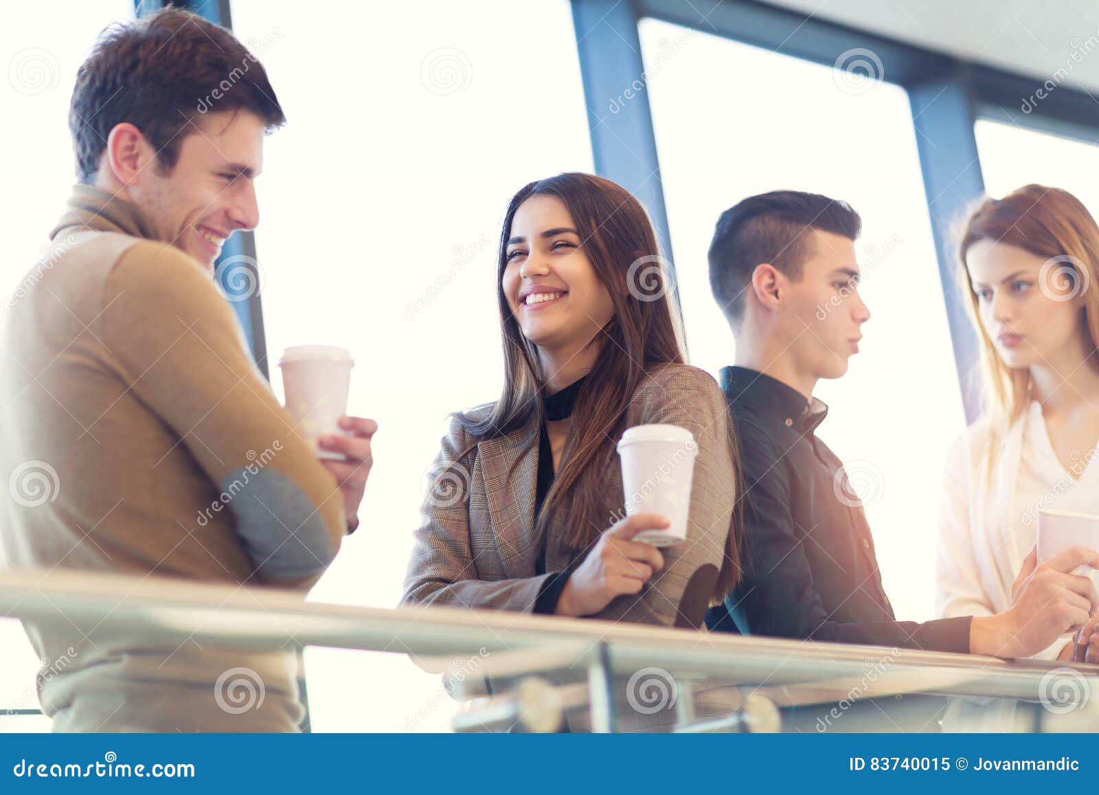 Group of Four Young Business People on a Coffee Break Stock Image ...
