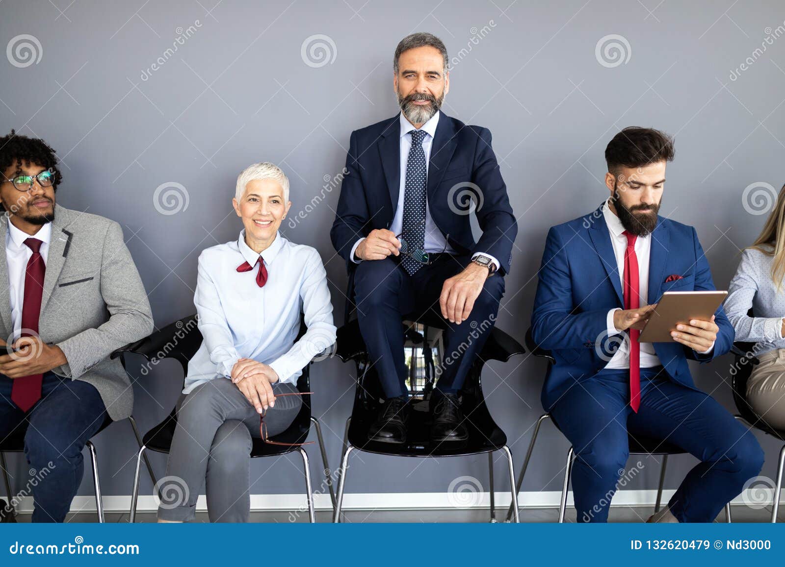 Group of Friendly Businesspeople with Male Leader in Front Stock Image ...