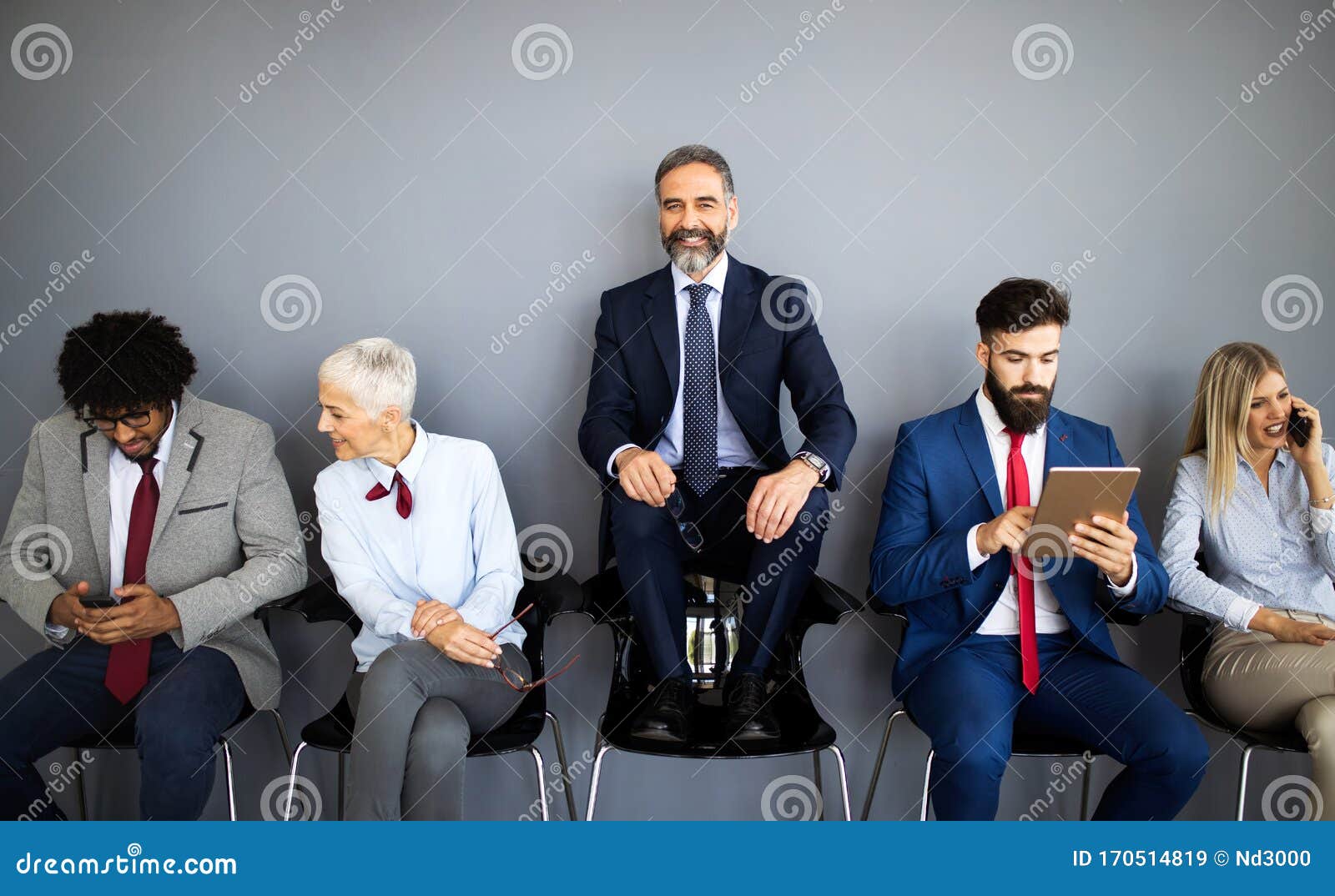 Group of Friendly Businesspeople with Male Leader in Front Stock Image ...