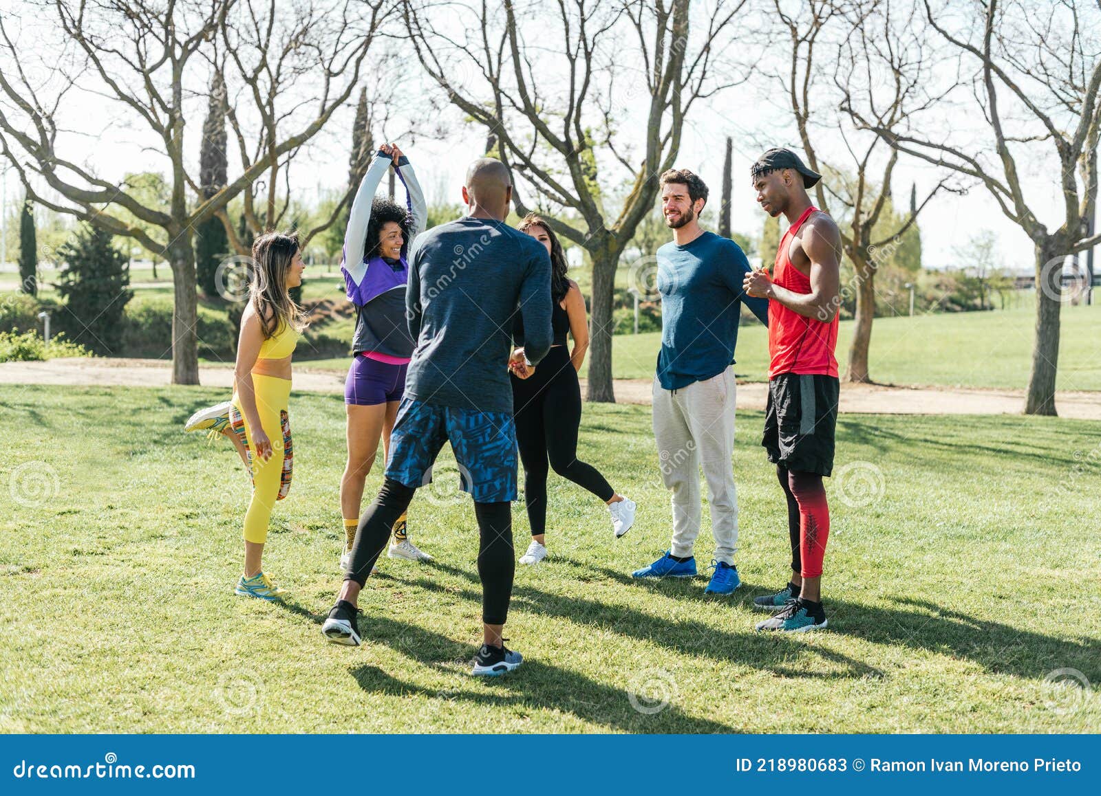 Group of Friendly Runners Talking in a Park before Training. Stock ...
