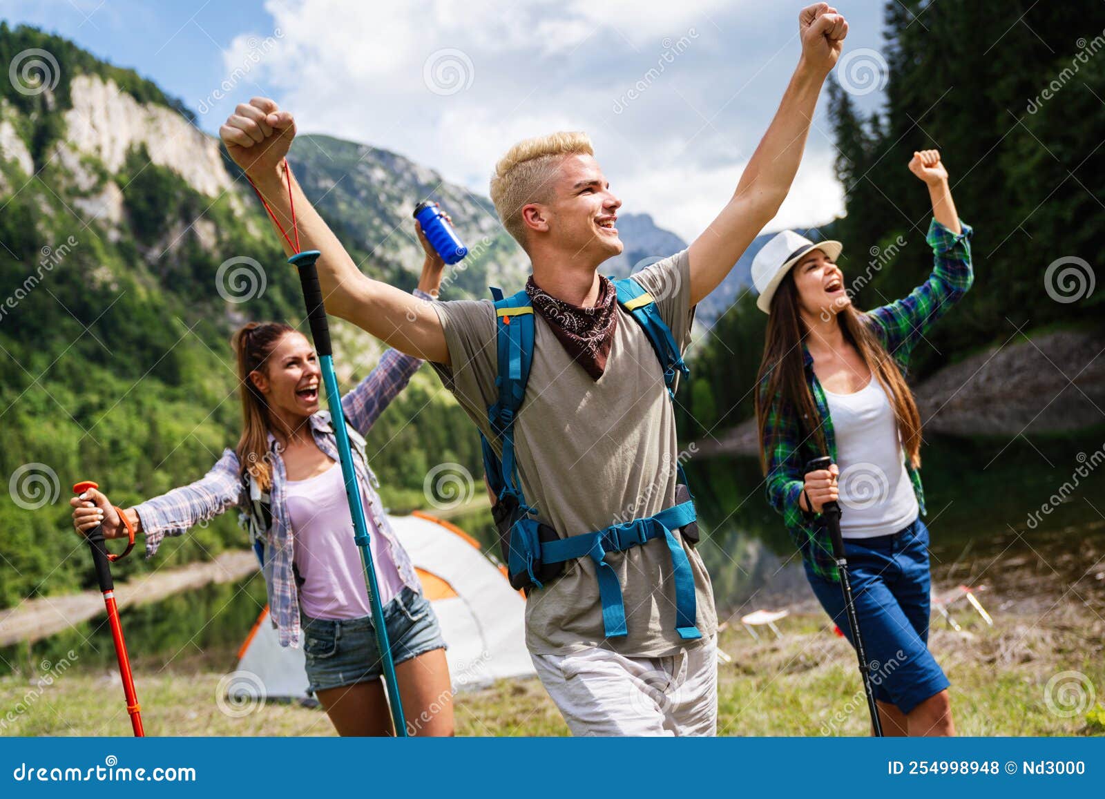 Group of Friends with Backpacks Doing Trekking Excursion on Mountain ...