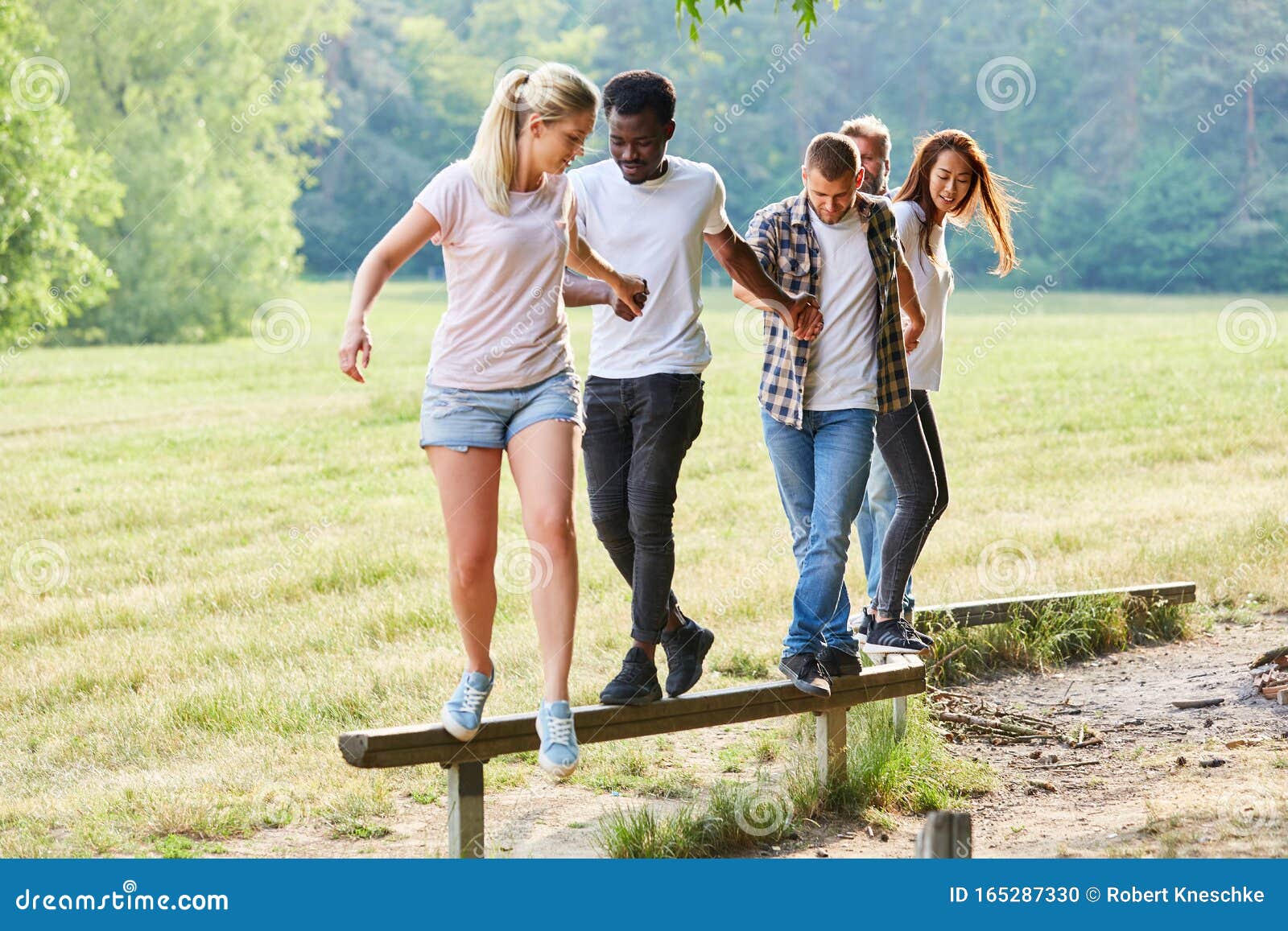 Group of Friends Balancing on Beams Stock Photo - Image of teambuilding ...