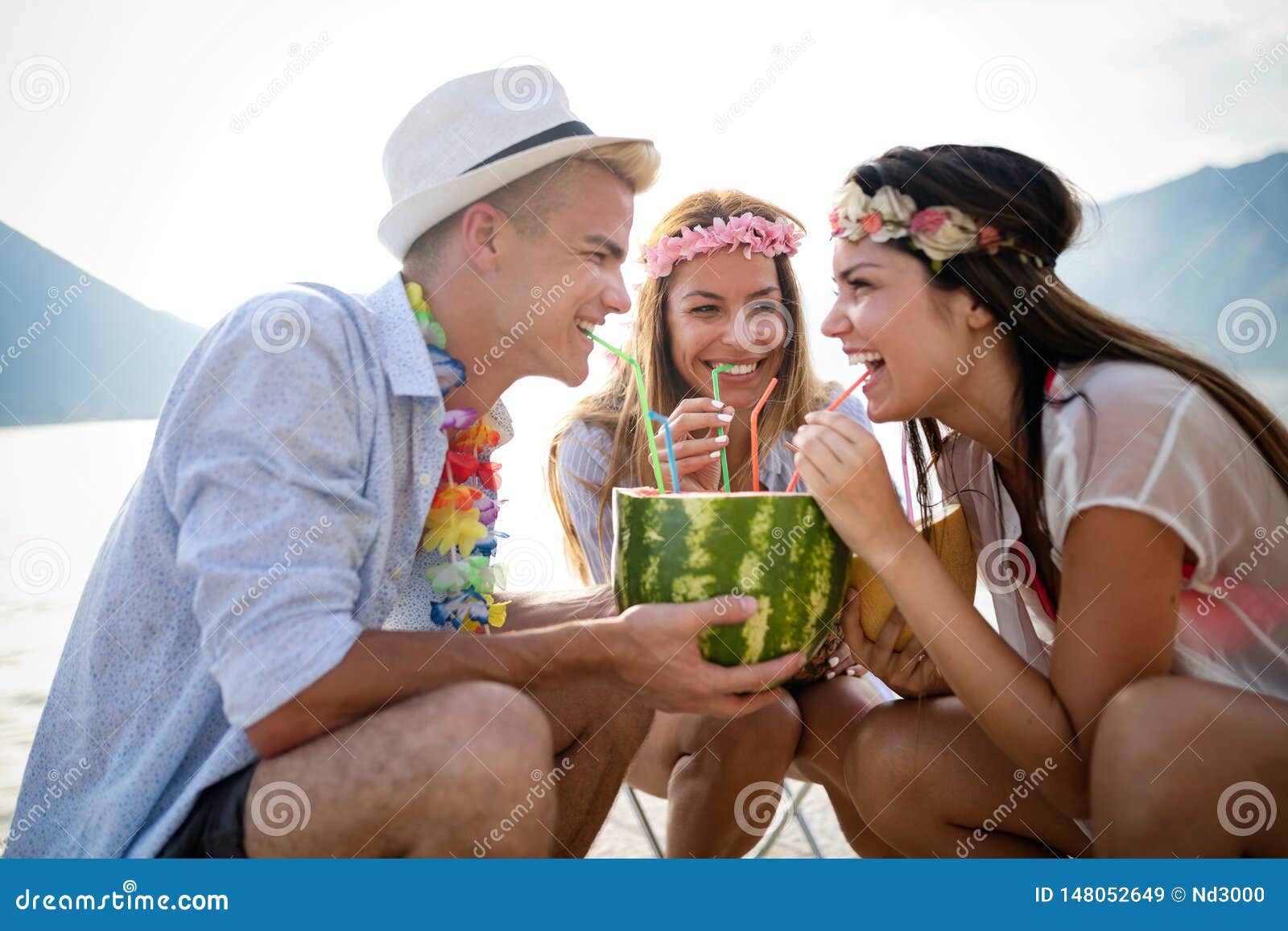 Group of Friends at Beach Drinking and Having Fun. Summer Party. Stock ...