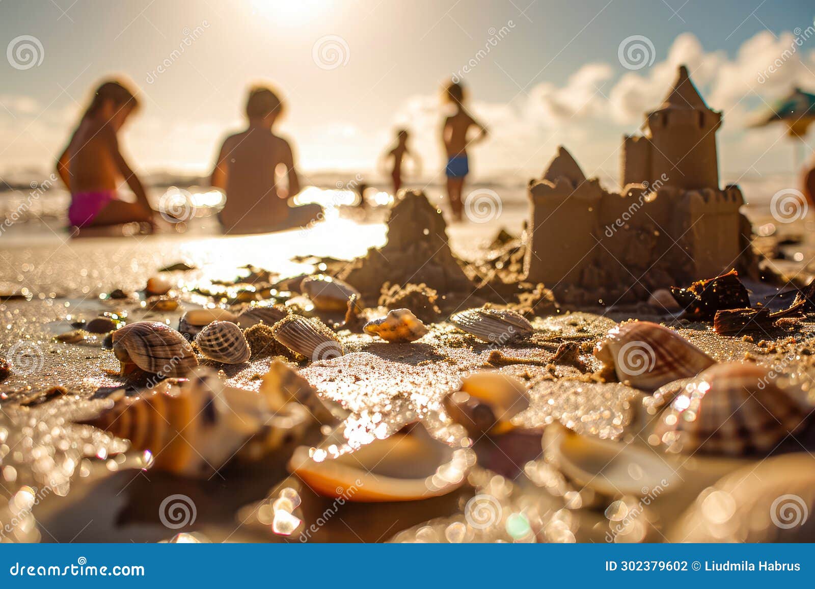 Group of Friends Building Sandcastles on the Beach, Their Laughter ...