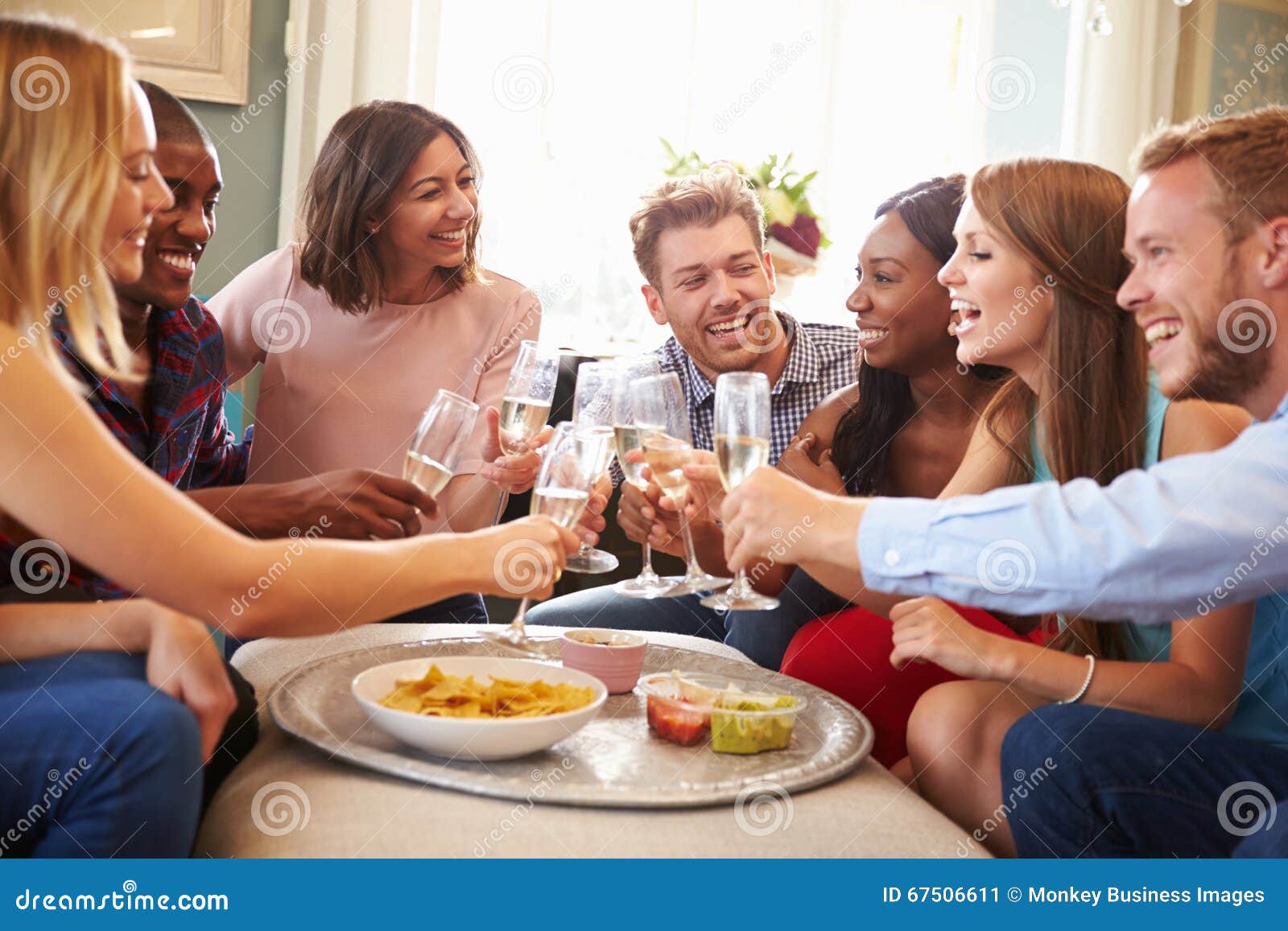Group of Friends Celebrating with a Toast at Home Stock Image - Image ...