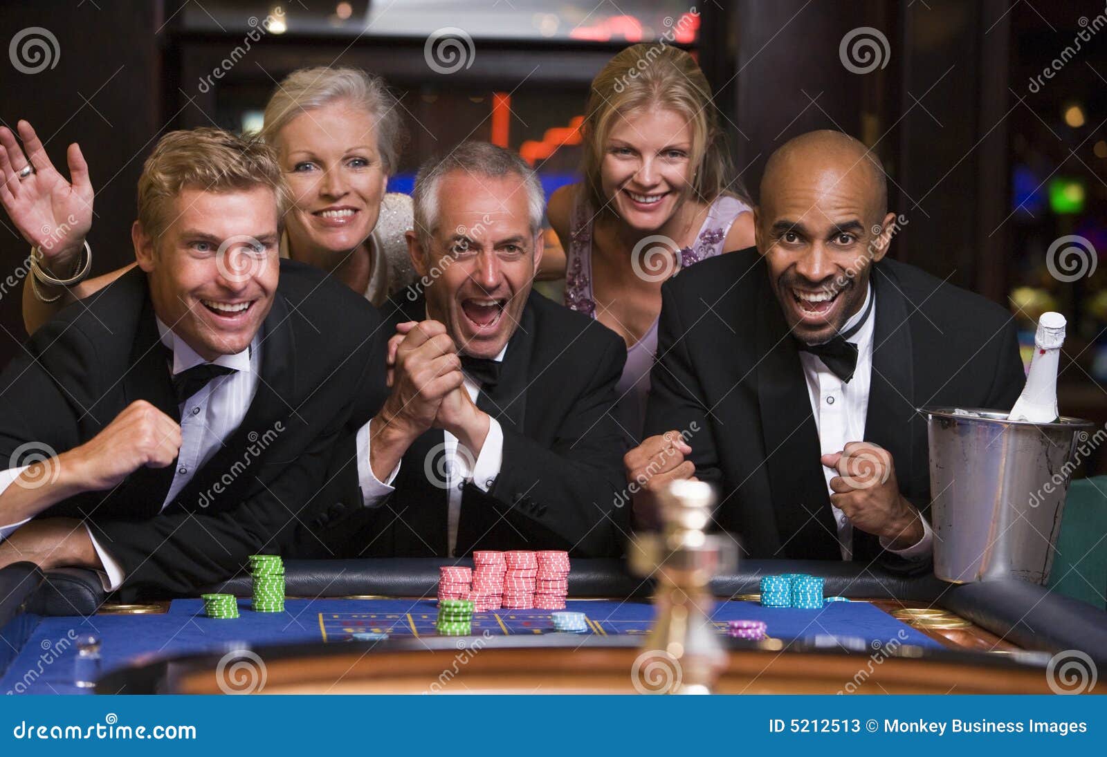 Group of Friends Celebrating Win at Roulette Table Stock Image - Image ...