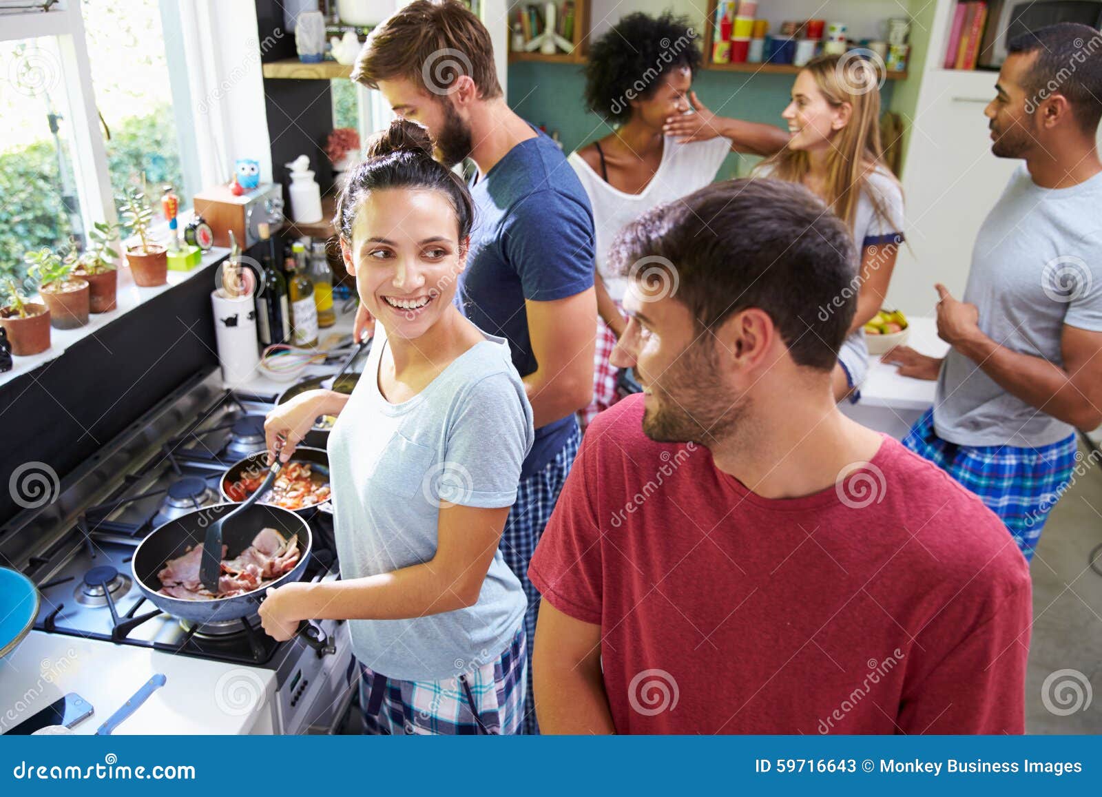 Group of Friends Cooking Breakfast in Kitchen Together Stock Image ...